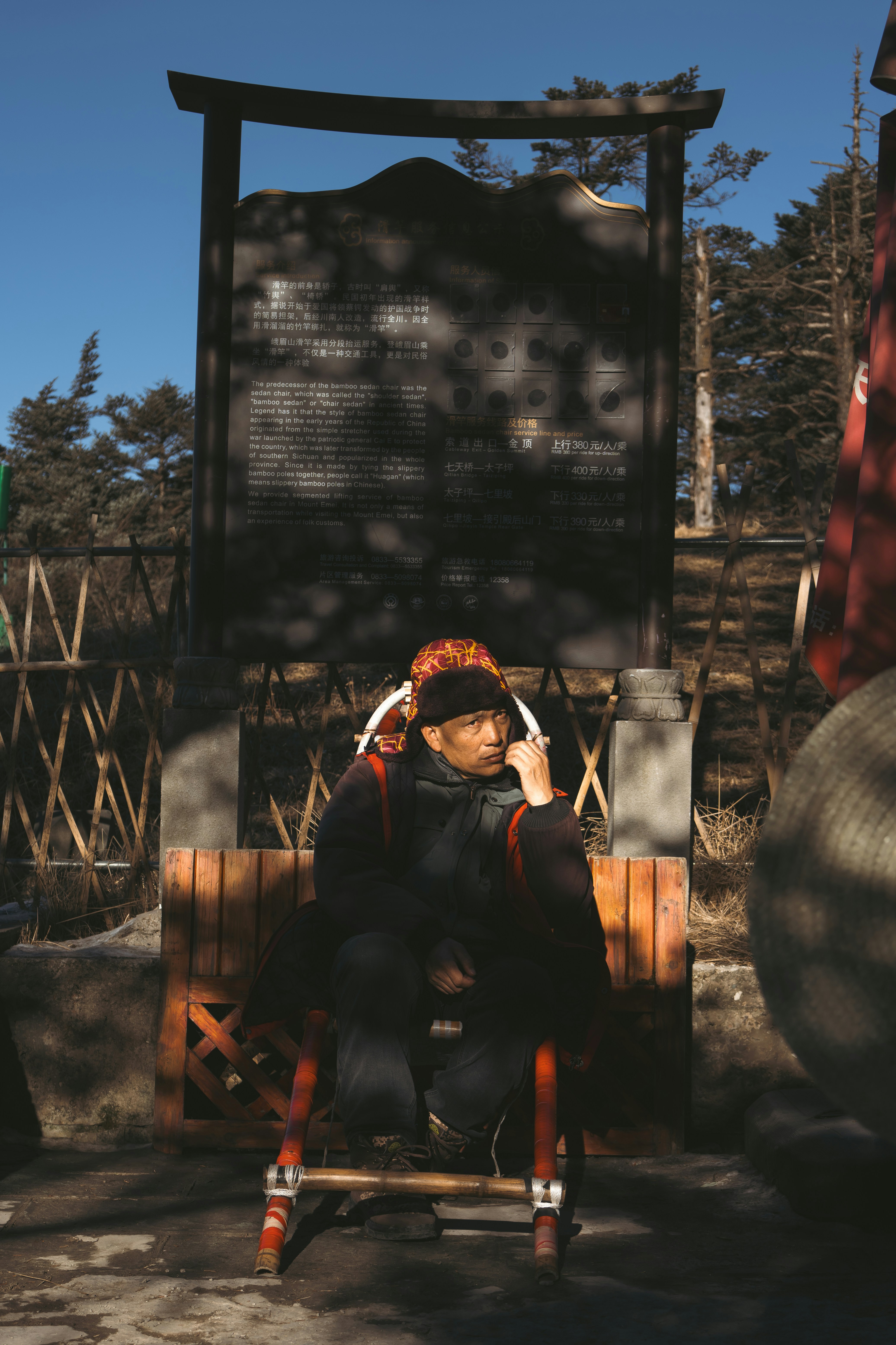Senior Shadows: A Quiet Wait by the Information Board