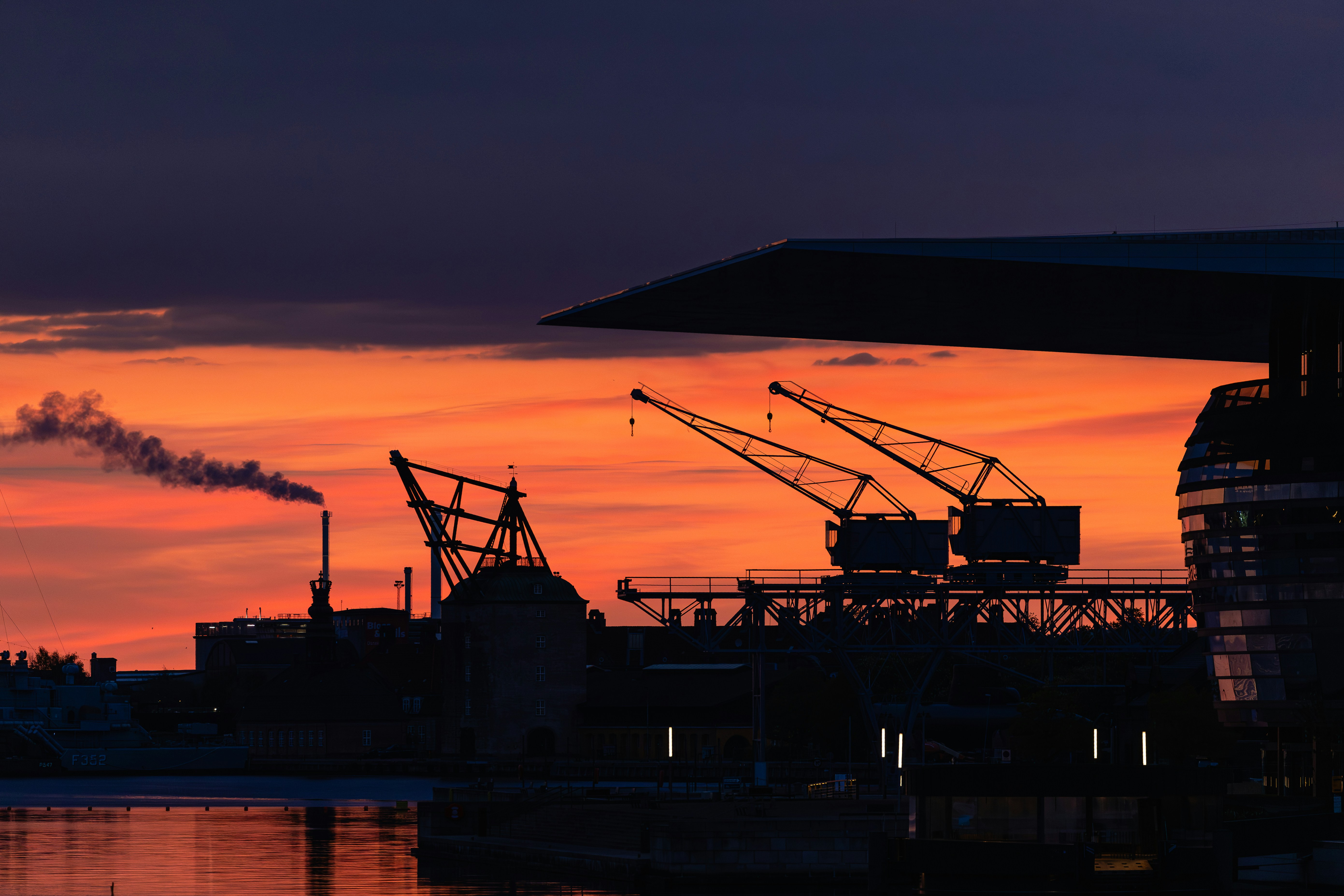 Crimson Skyline Over the Silent Crane Yard
