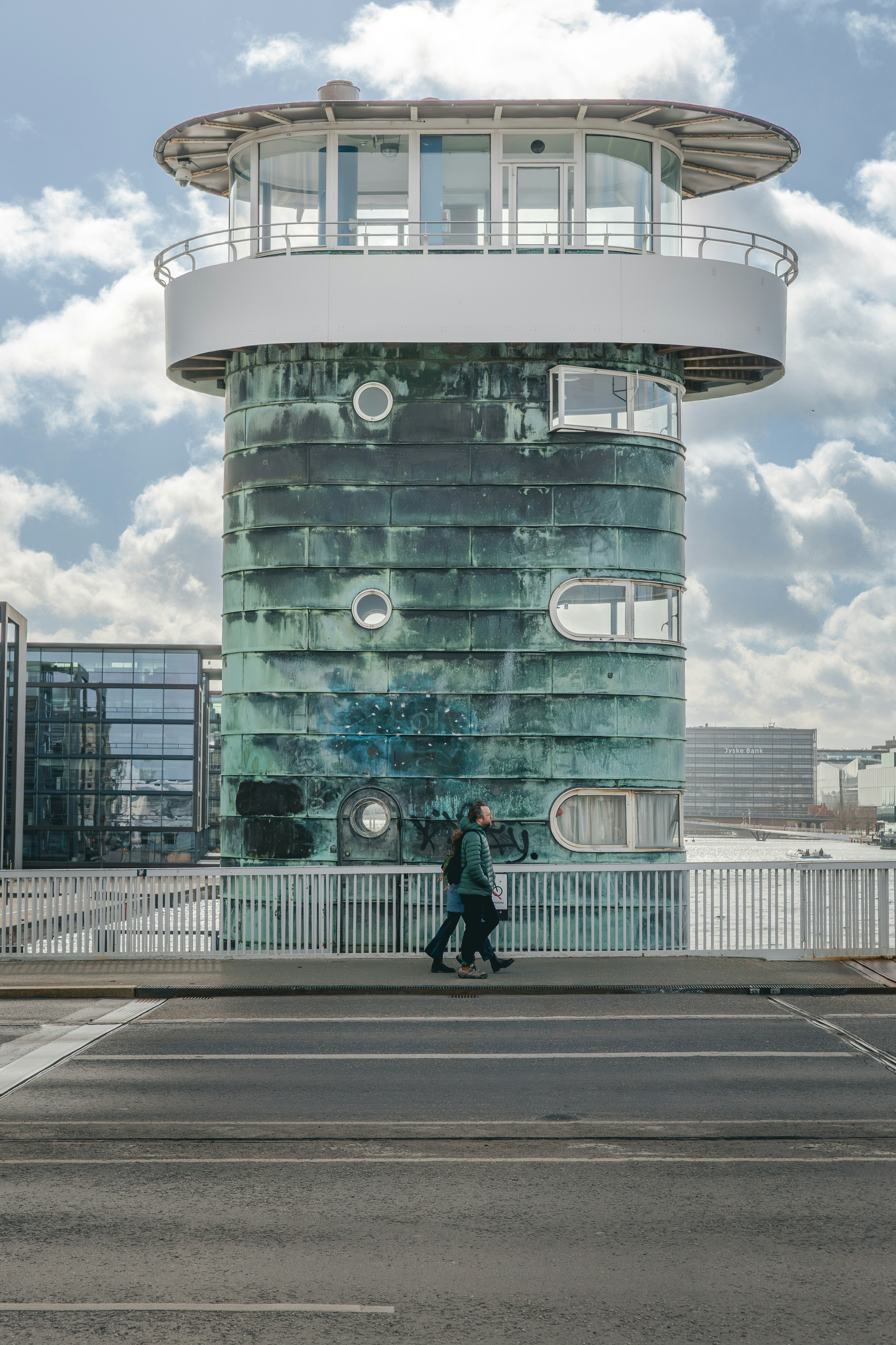 Towering Turquoise Observatory Along a Quiet City Street
