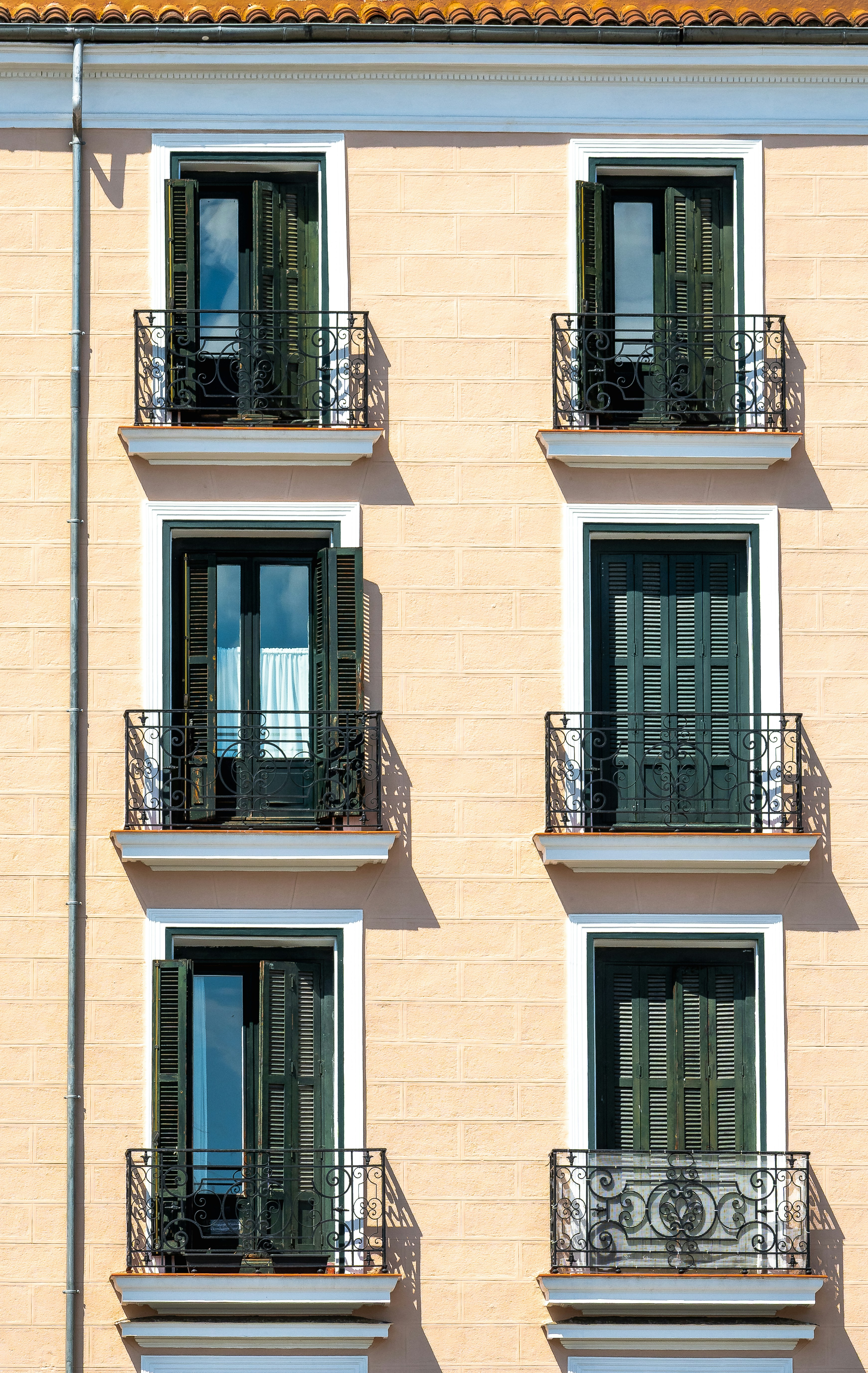 Building facade with six windows and balconies