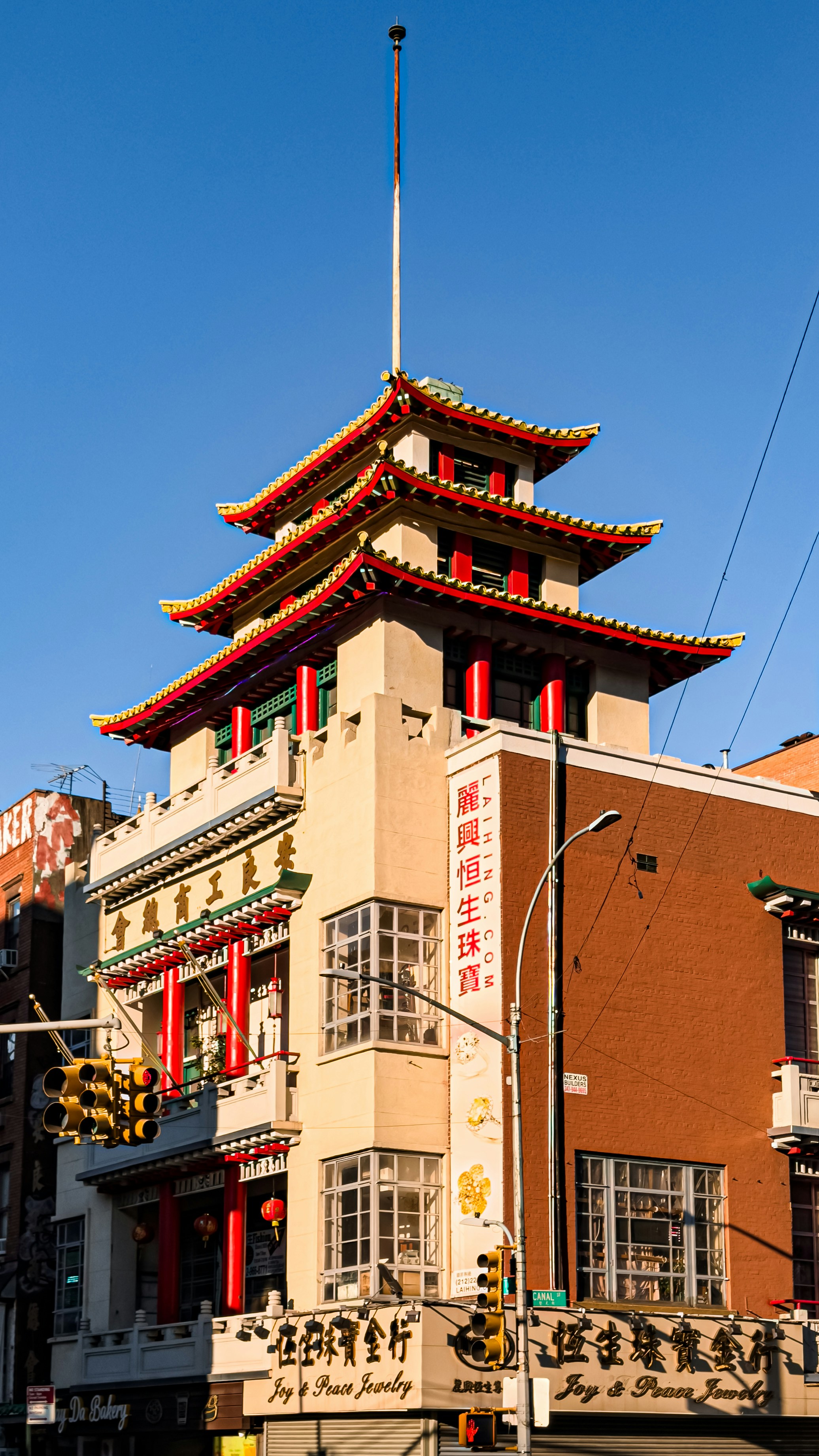 Temple Tower Rises Above a Busy Chinatown Street