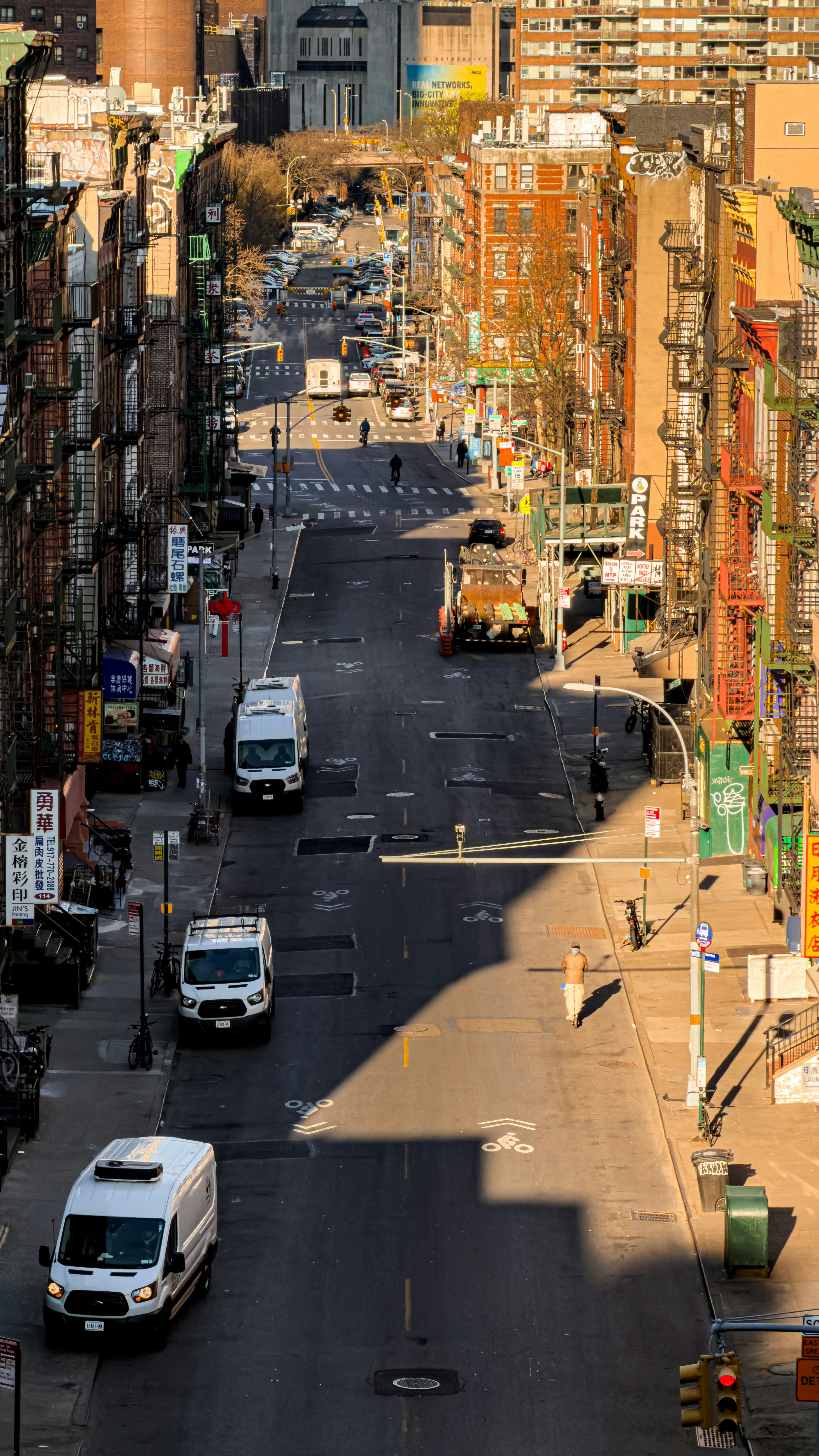 Sunlit Avenue: City Block in Golden Hour Shadow Play