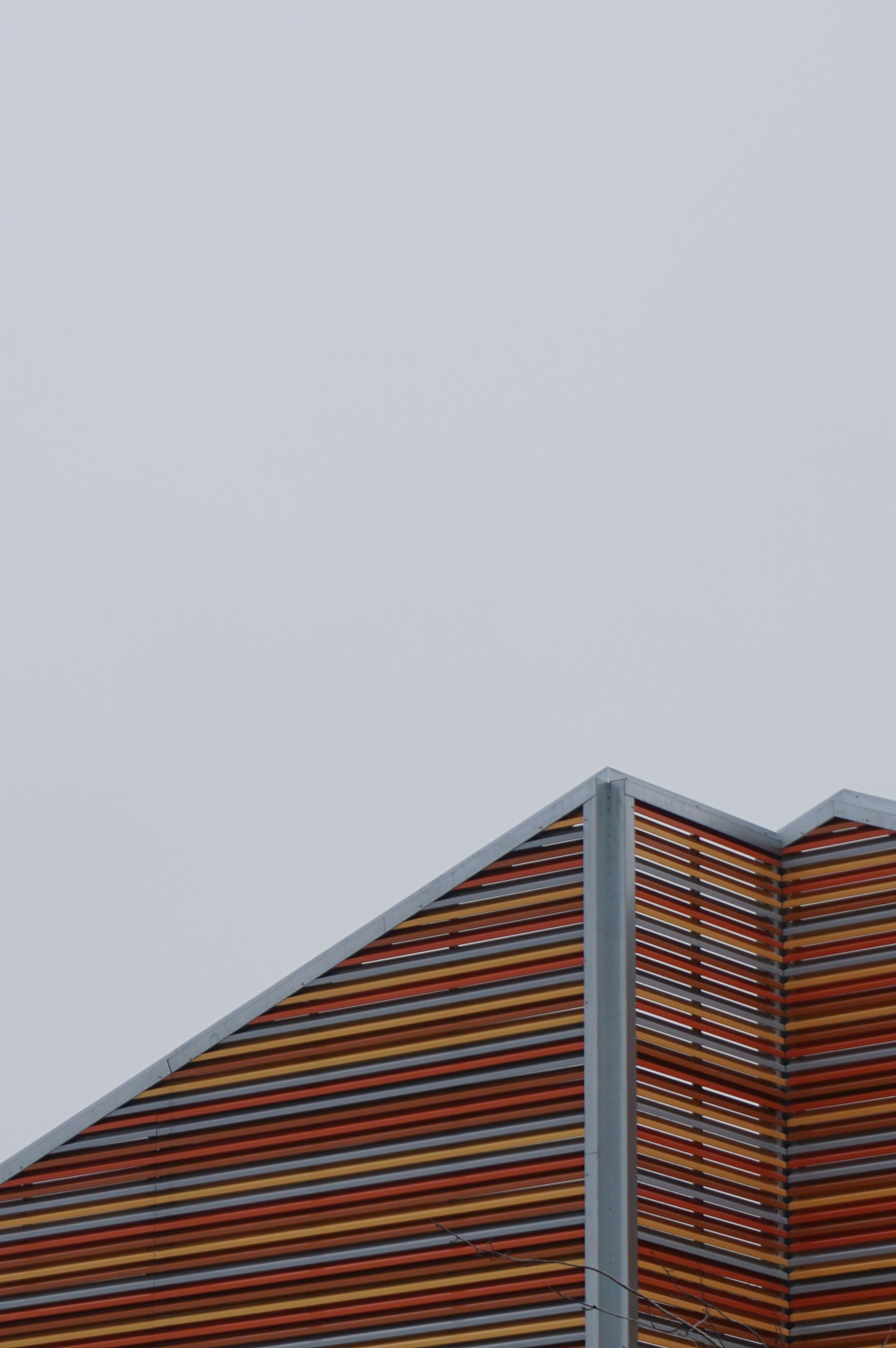 Diagonal Facade: Stripes and Steel Meet the Sky