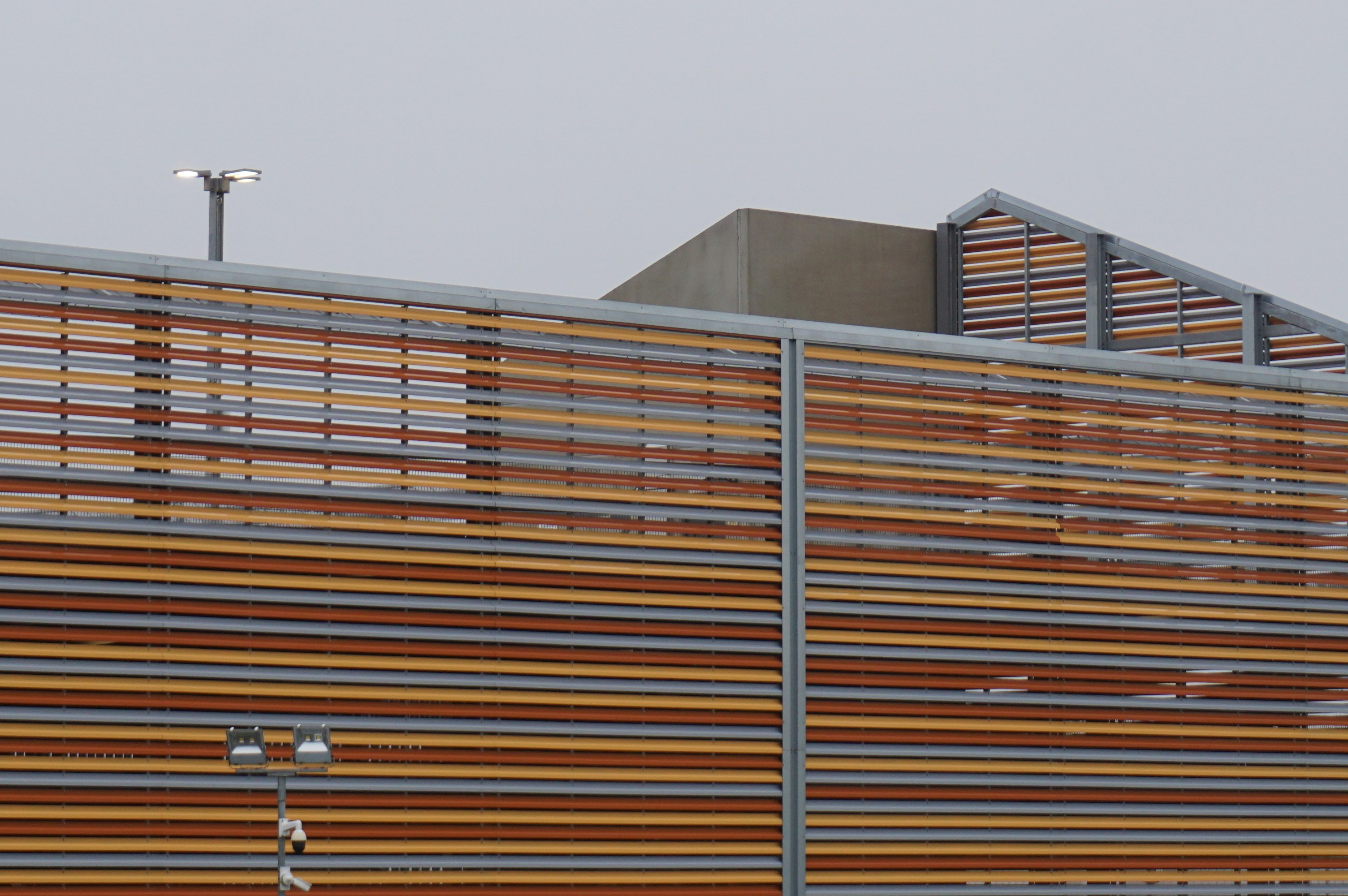 Louvered Facade Lines Against a Minimal Skyline