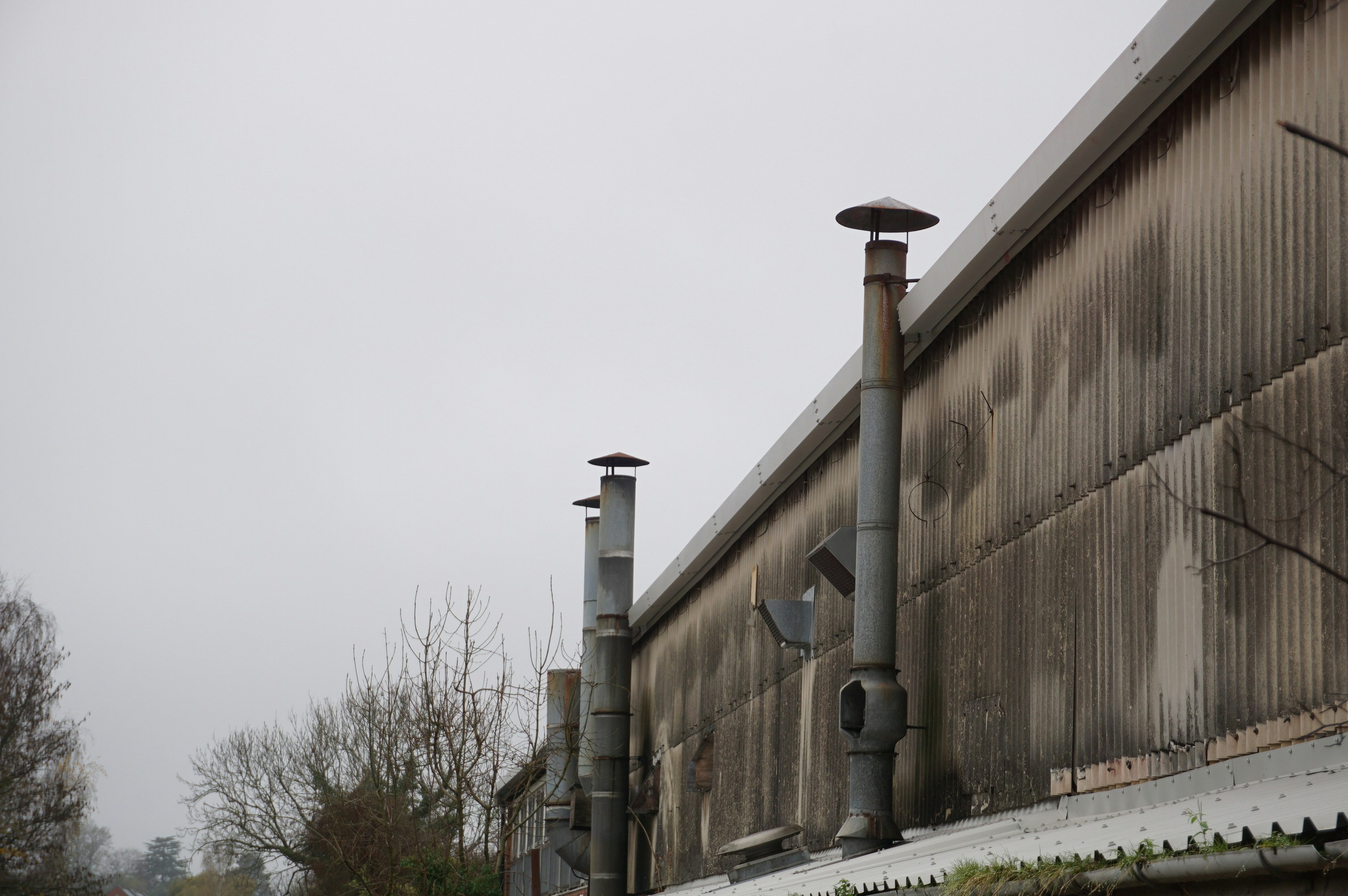 Industrial Vents Against a Weathered Facade