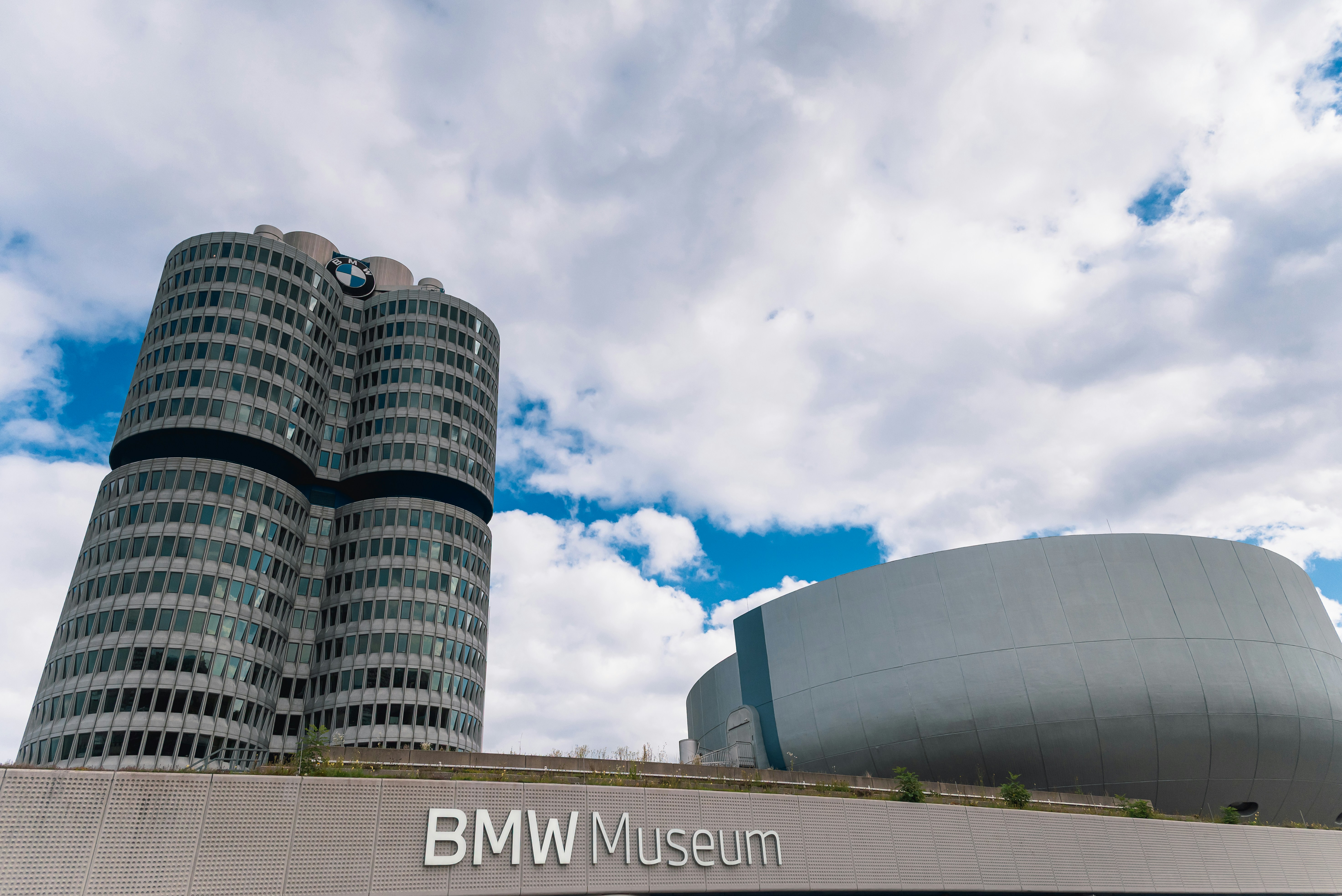 Architectural Echoes: BMW Museum’s Cylindrical Twin Towers Under a Skiescape