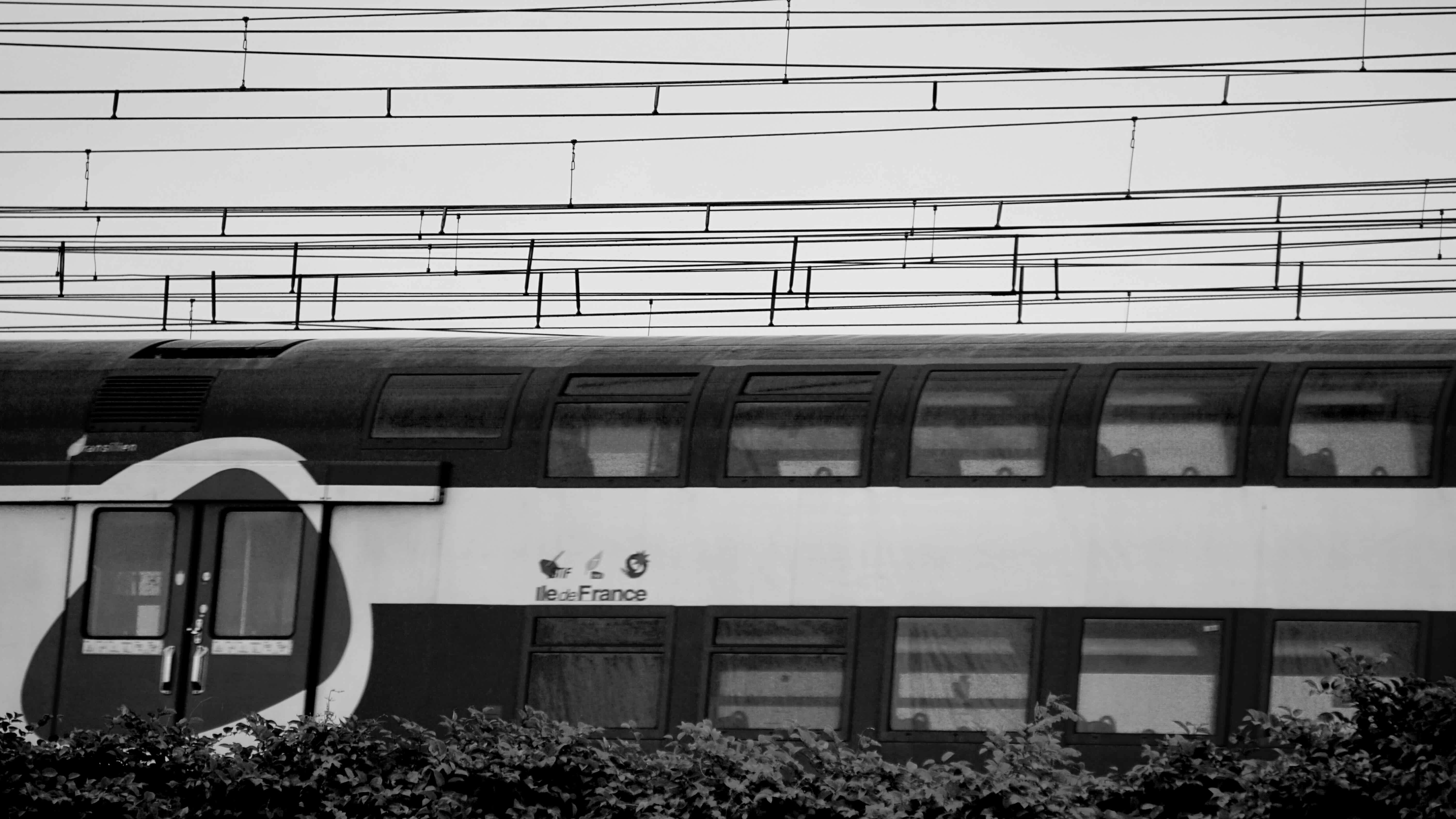 Railway car silhouette under an electro-urban sky