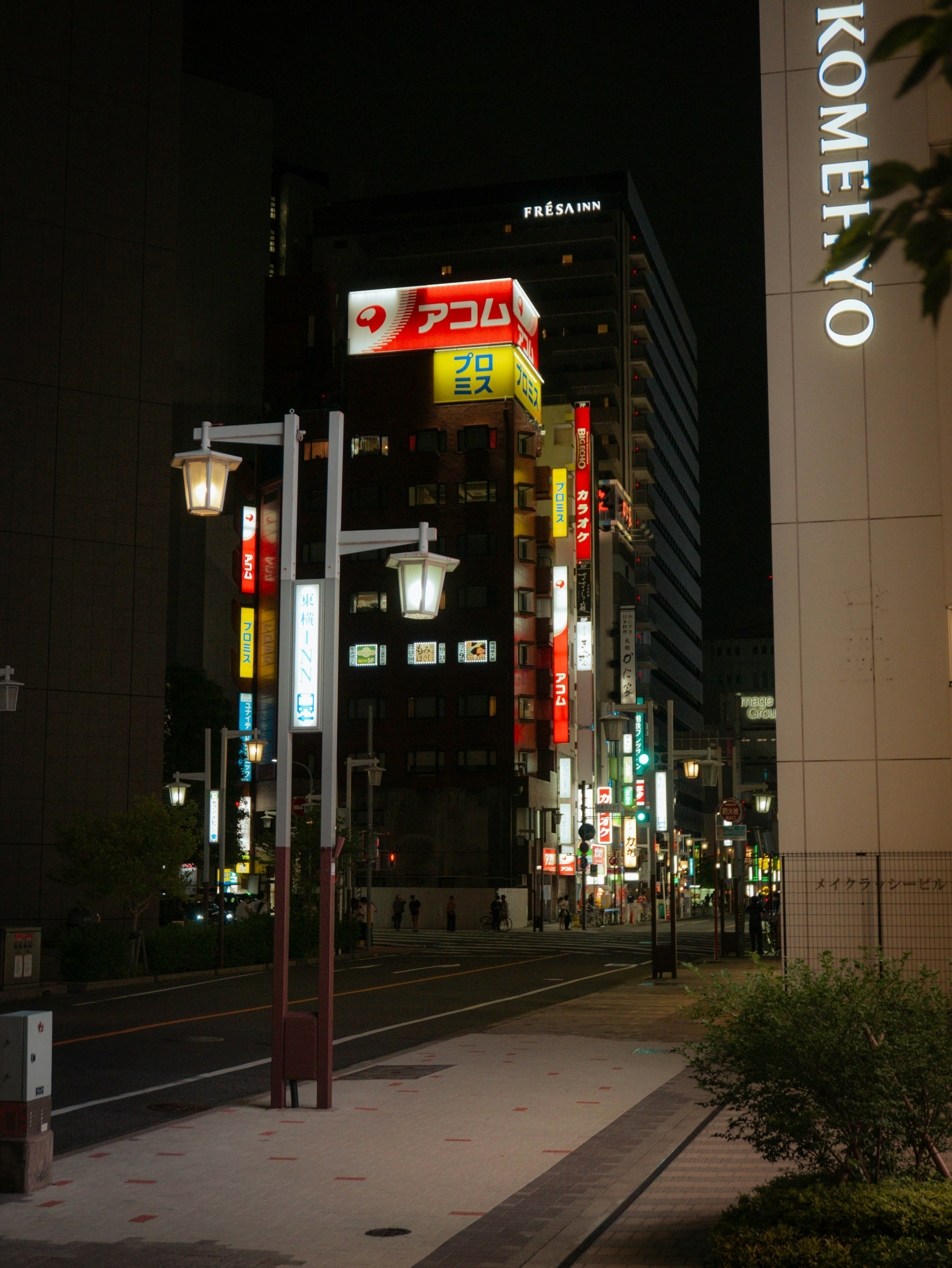 Neon Avenue: Nighttime Neon Pulse down a Quiet Tokyo Street