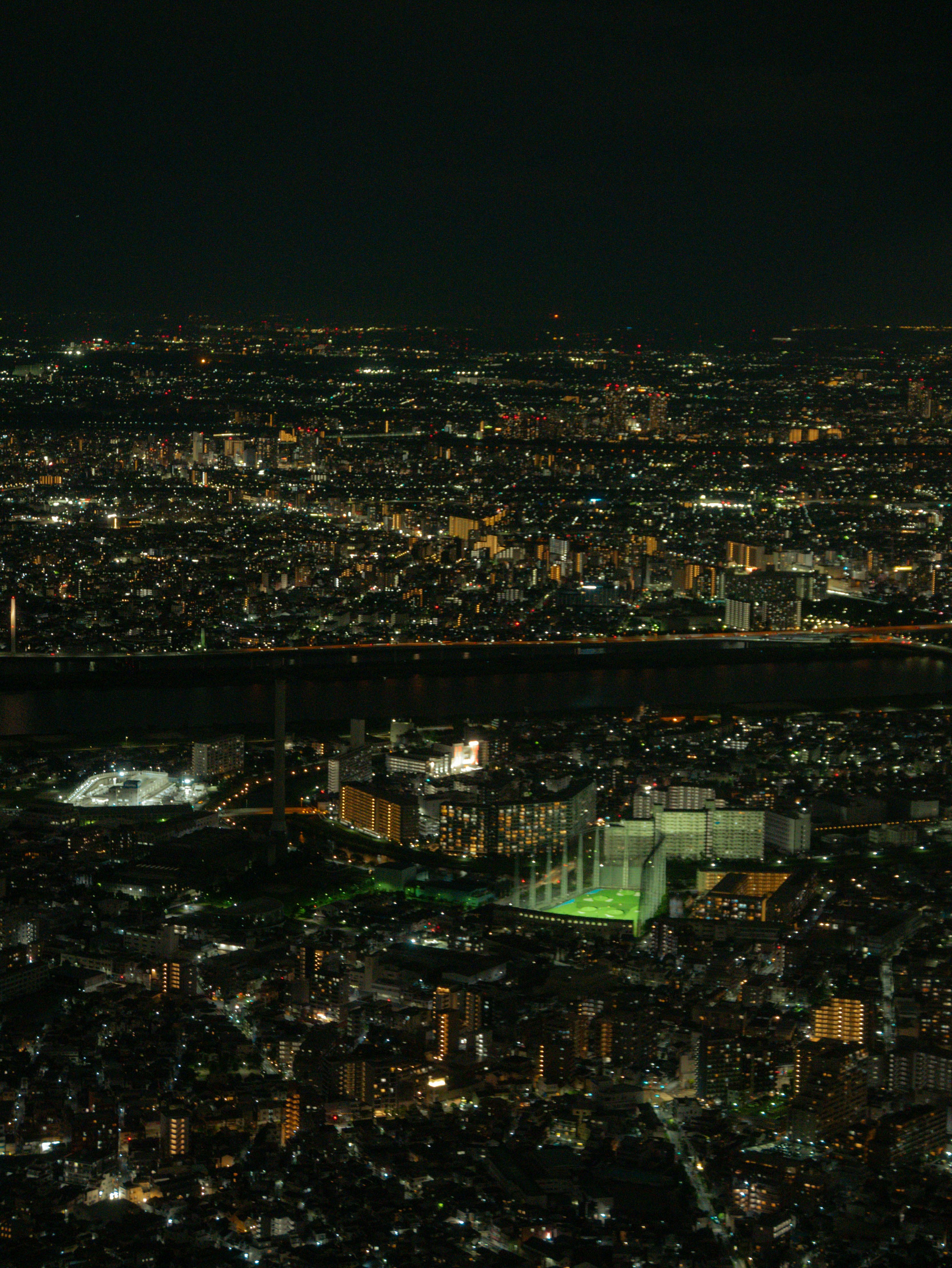 A Nighttime City Glow Across the River