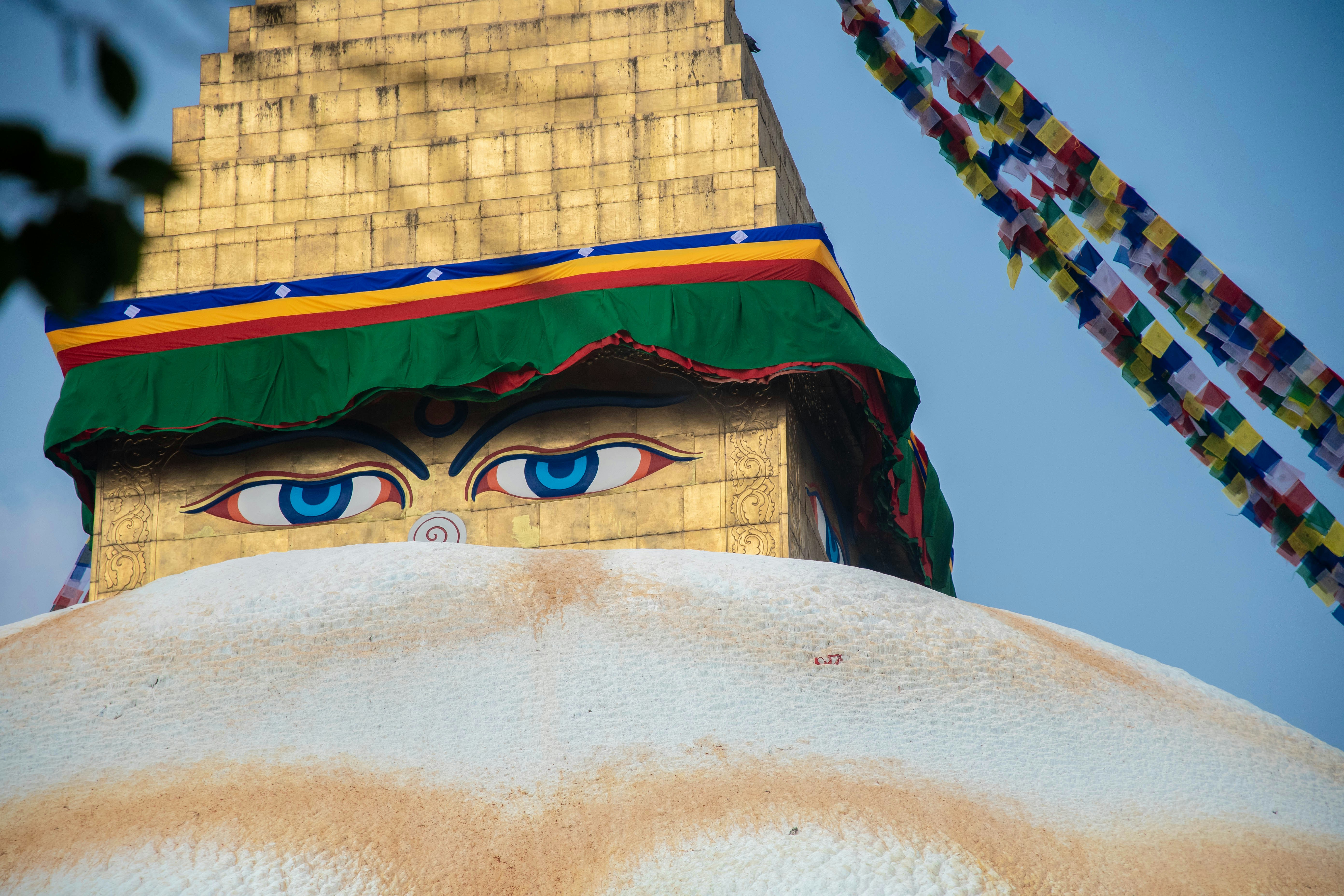 Eyes Behind the Prayer Flags: A Shrouded Peak with Tibetan Iconography