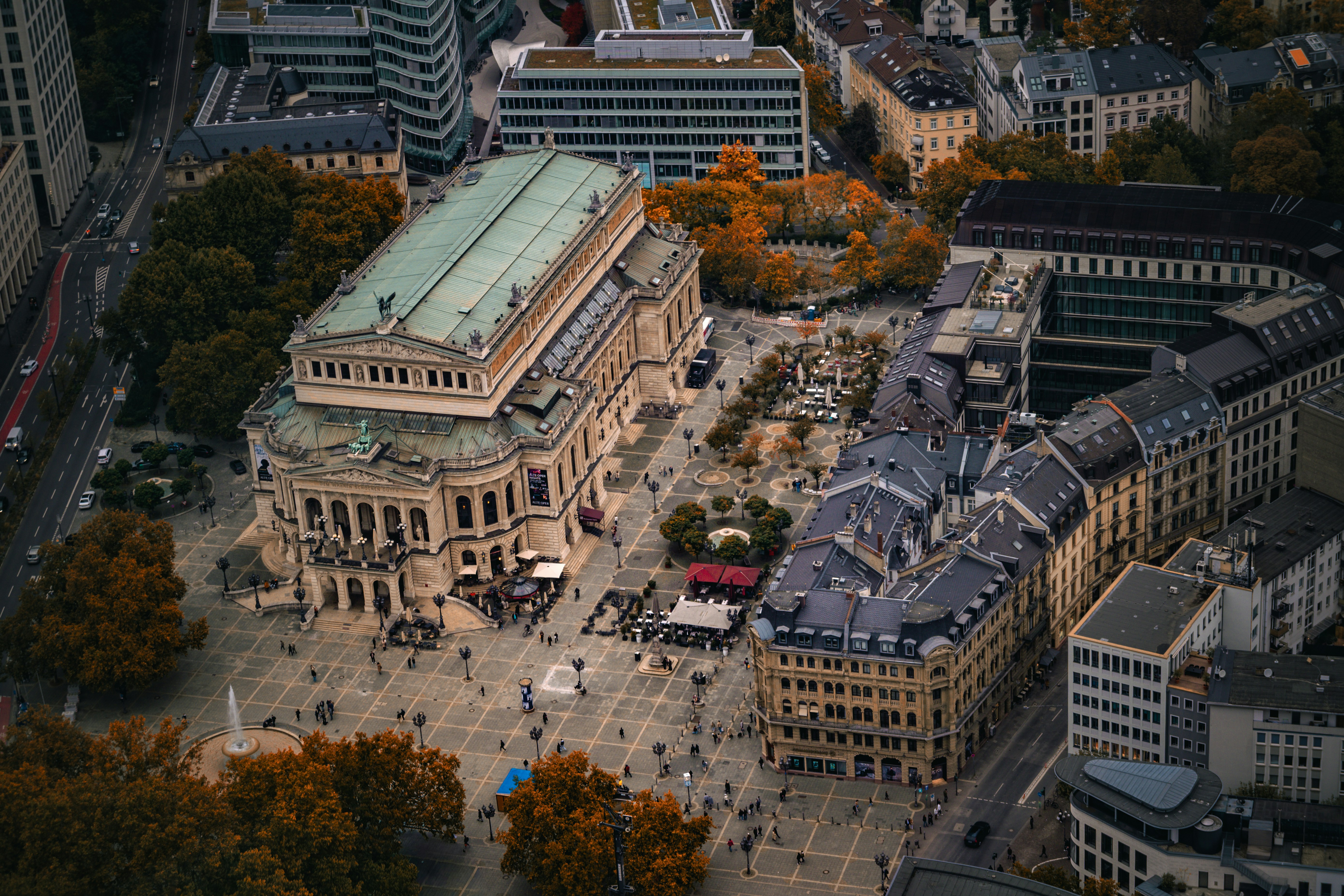 Aerial view of an ornate building and city square.