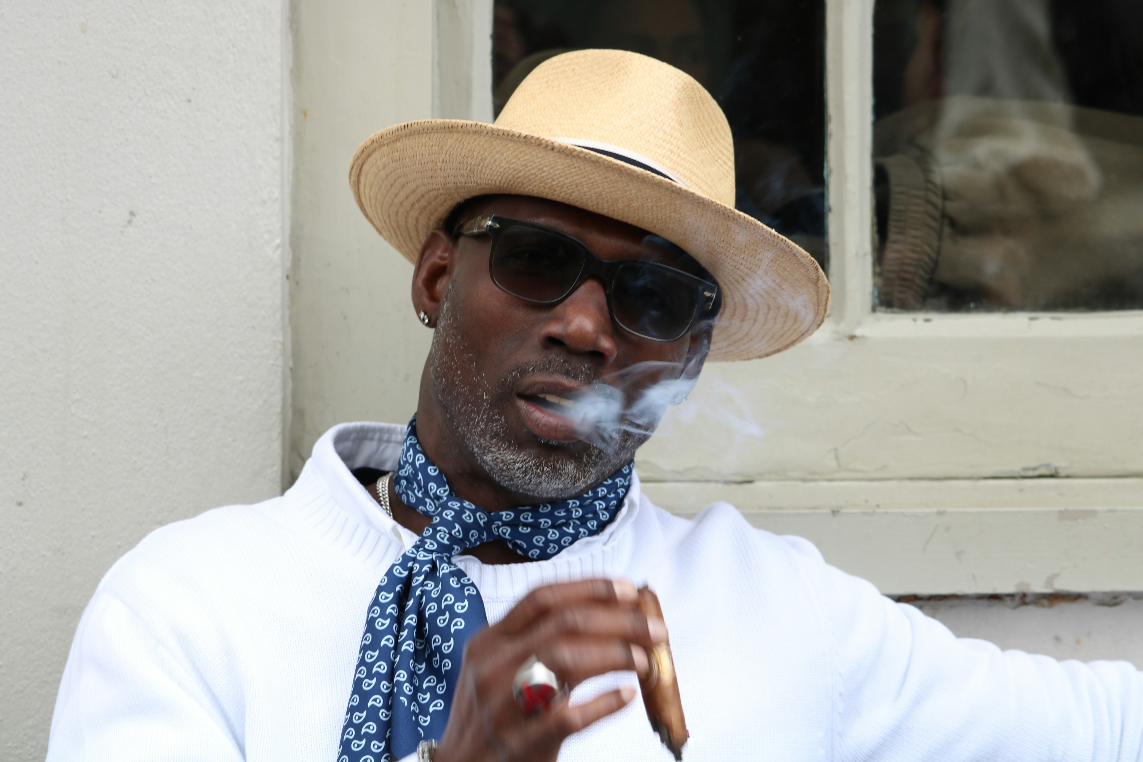 Smoke, Style, and Straw: A Relaxed Portrait in Sunlit Streetwear