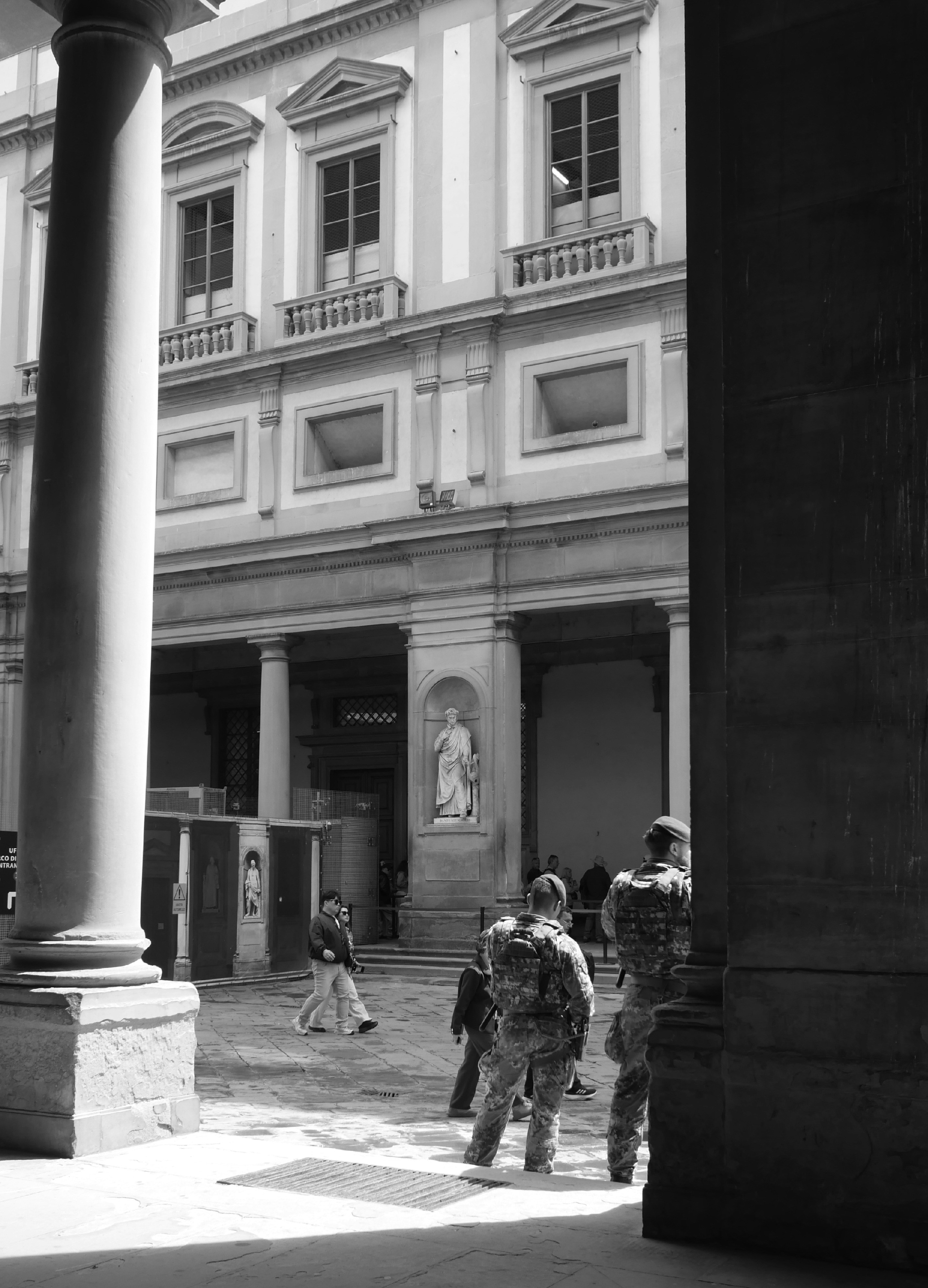 Guarded Archways: Soldiers at the Courtyard Facade