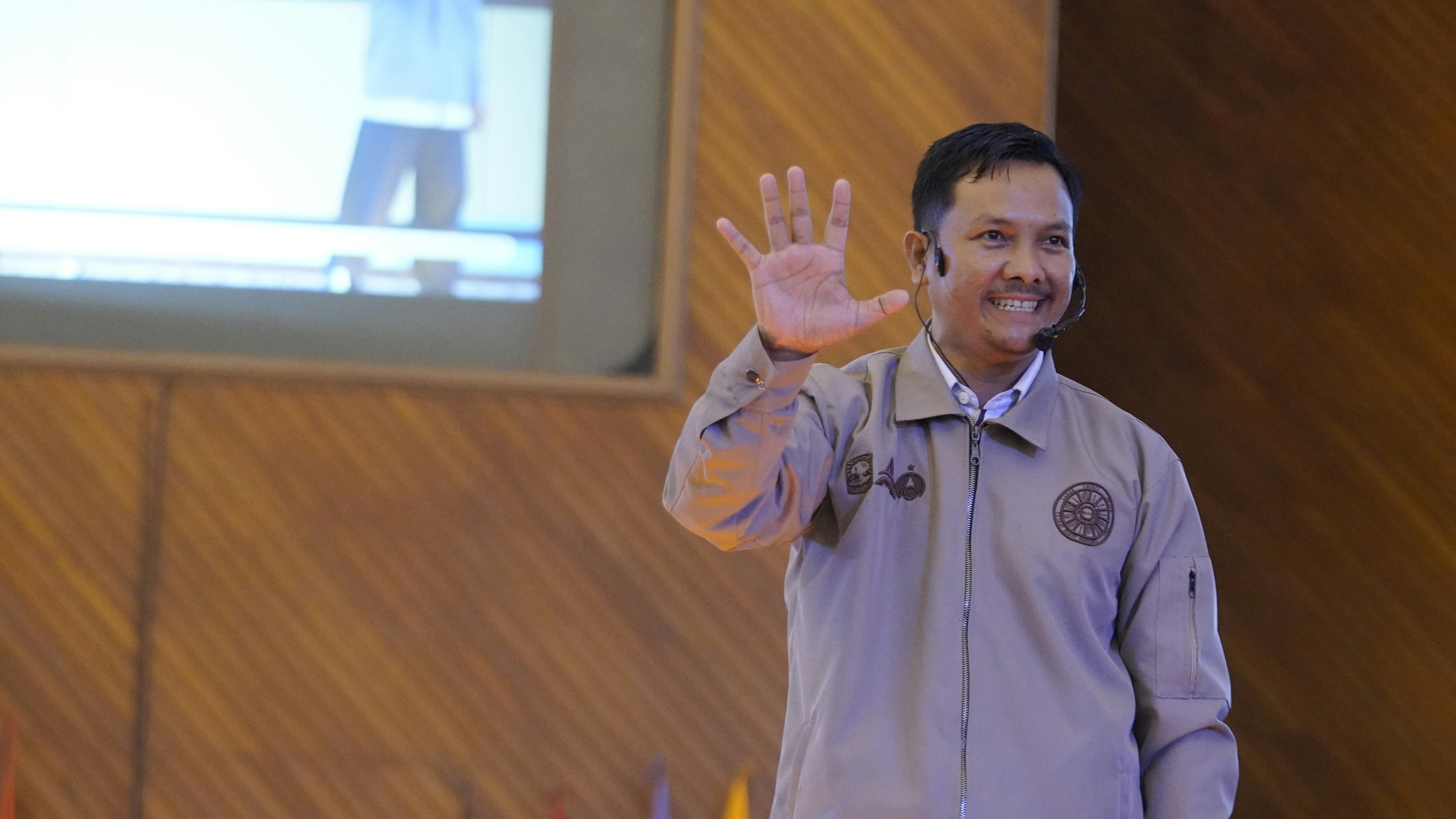 Handshake and Welcome in a Wood-Walled Hall