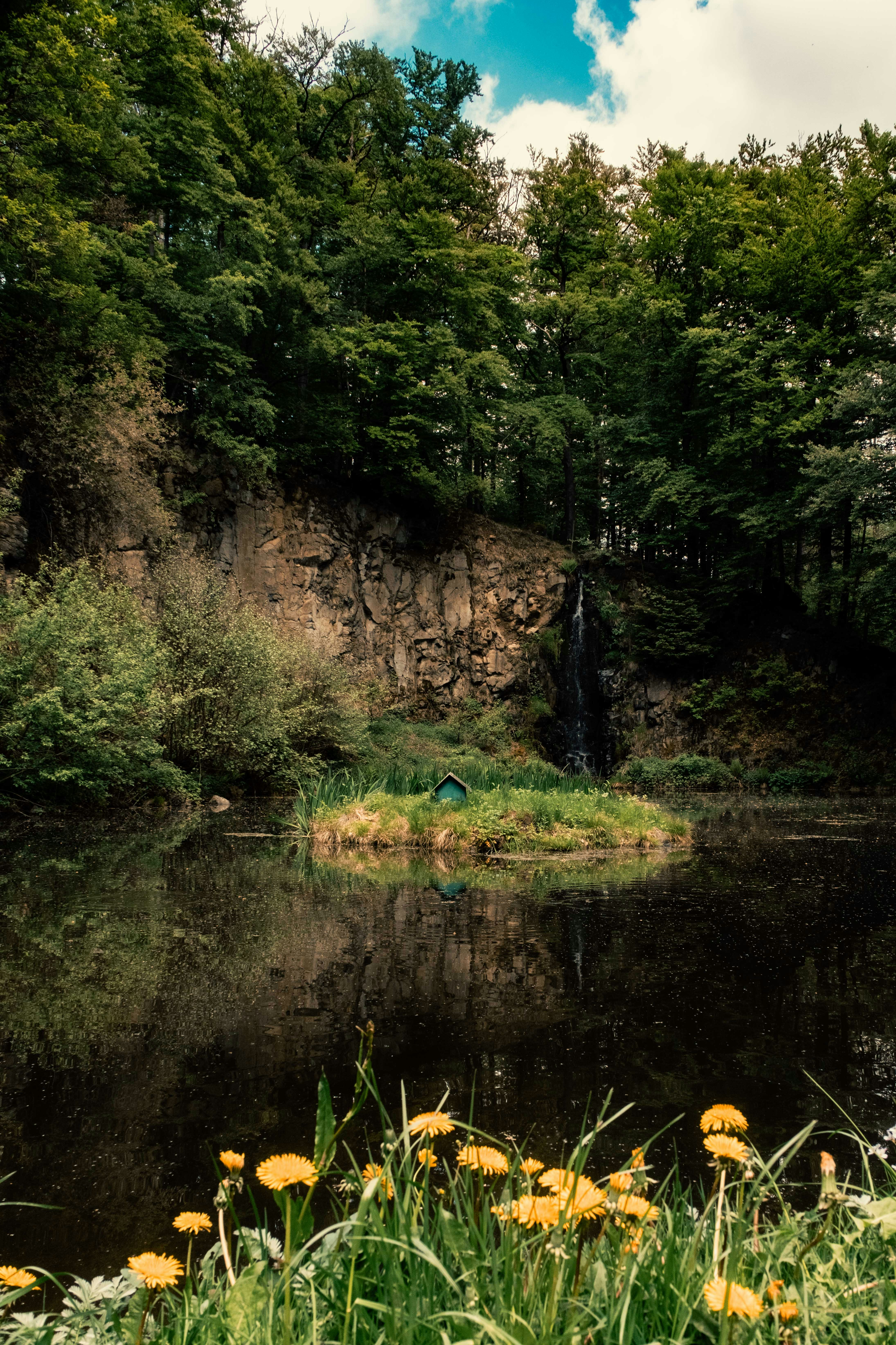 Hidden Campsite Beneath a Cascading Cliff
