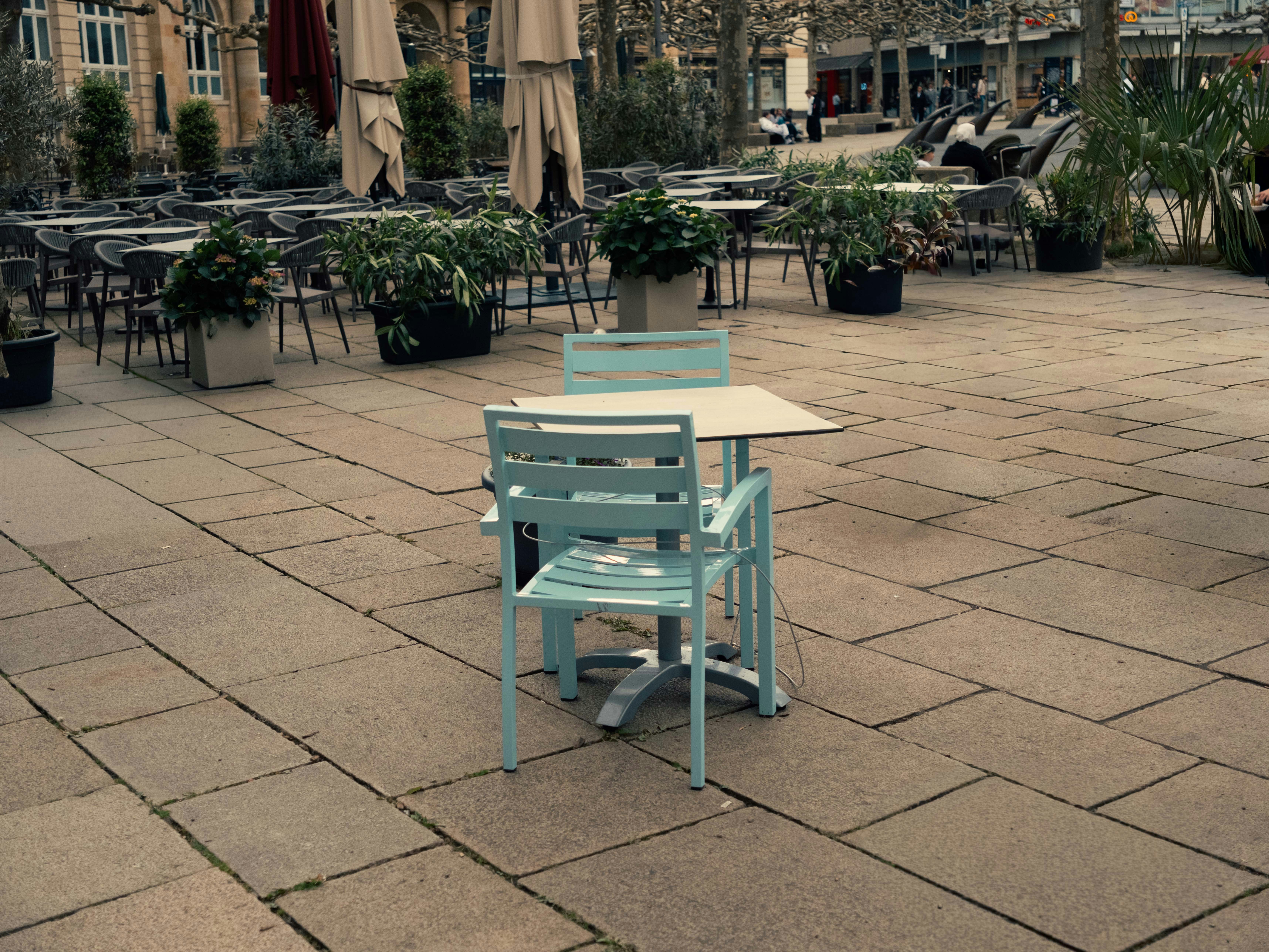 Pastel Patio Table for Two in an Urban Square
