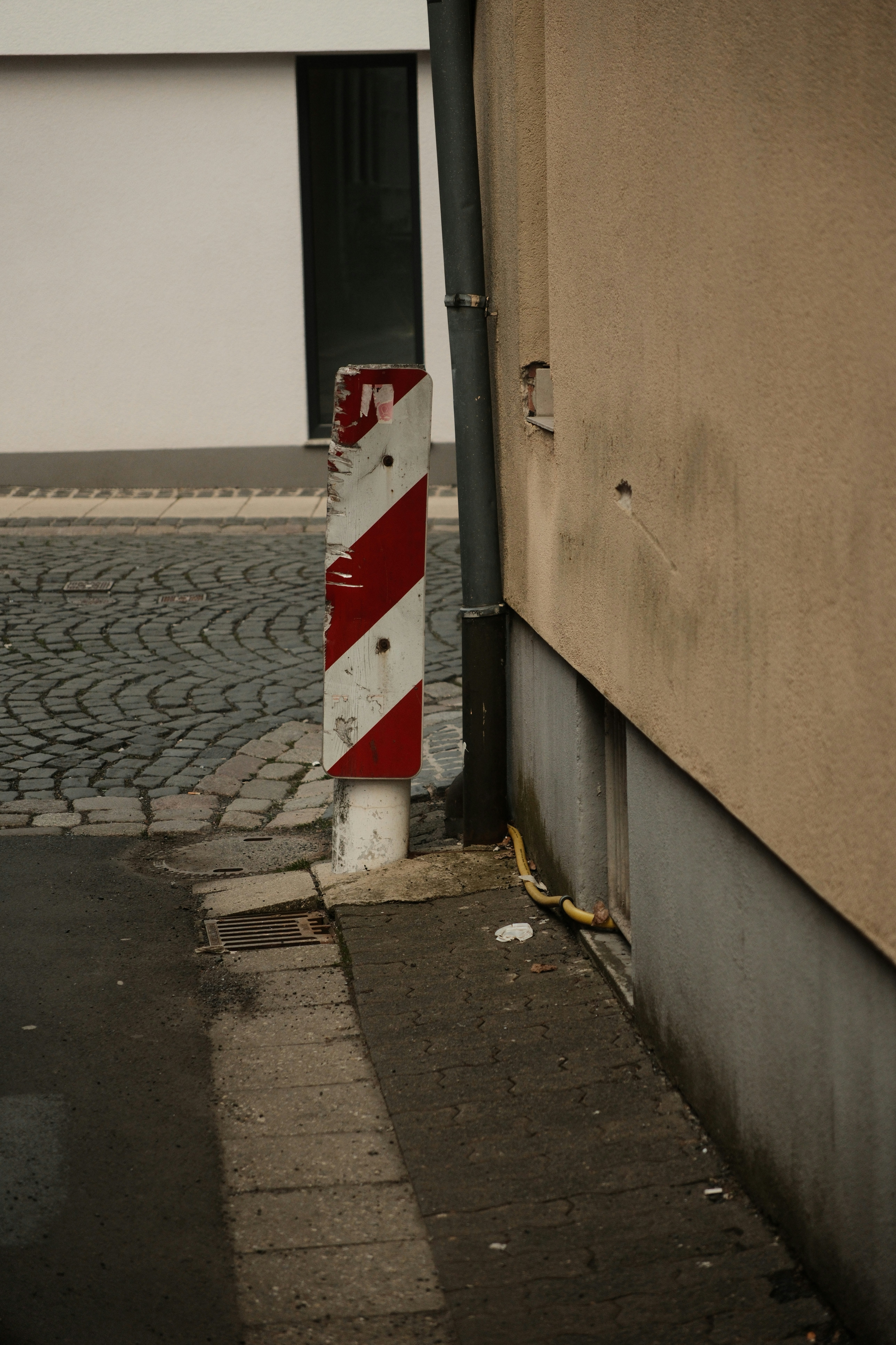 Red-and-White Street Hazard Stalwart by the Wall