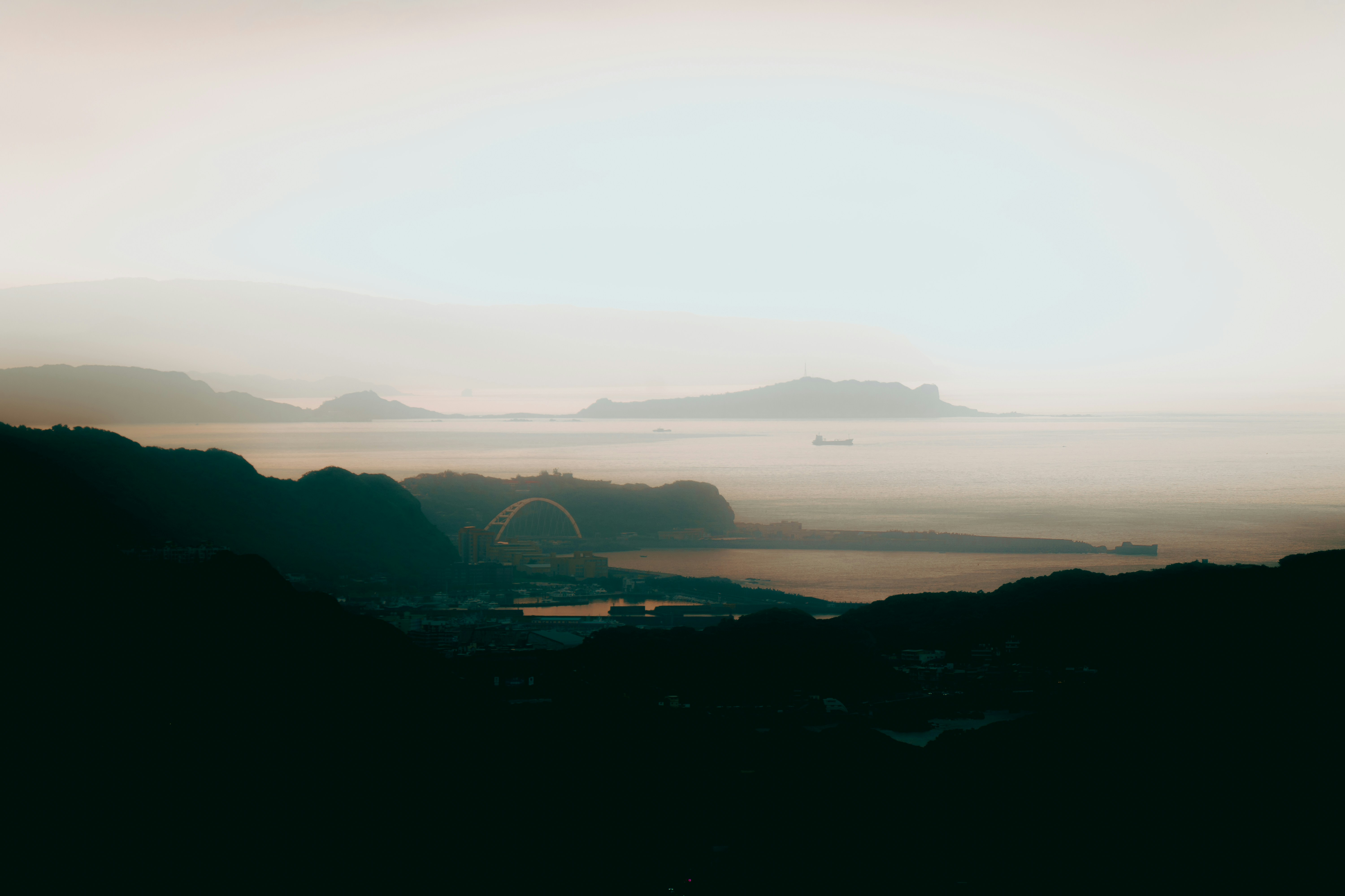 Quiet Horizon: Dusk Over Coastal Bluffs with Subtle Mist