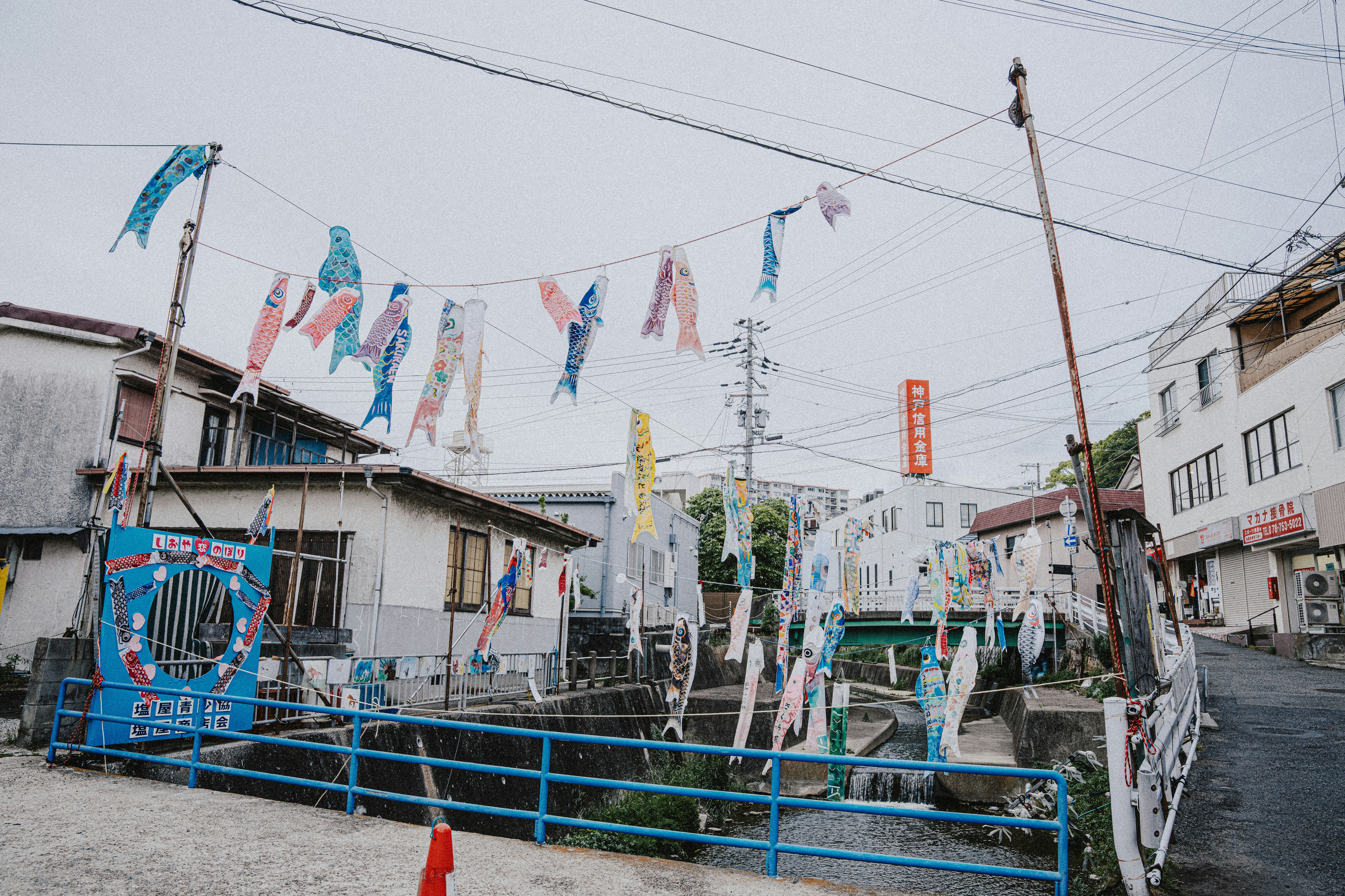 Colorful streamers over a quiet street festival in a seaside town