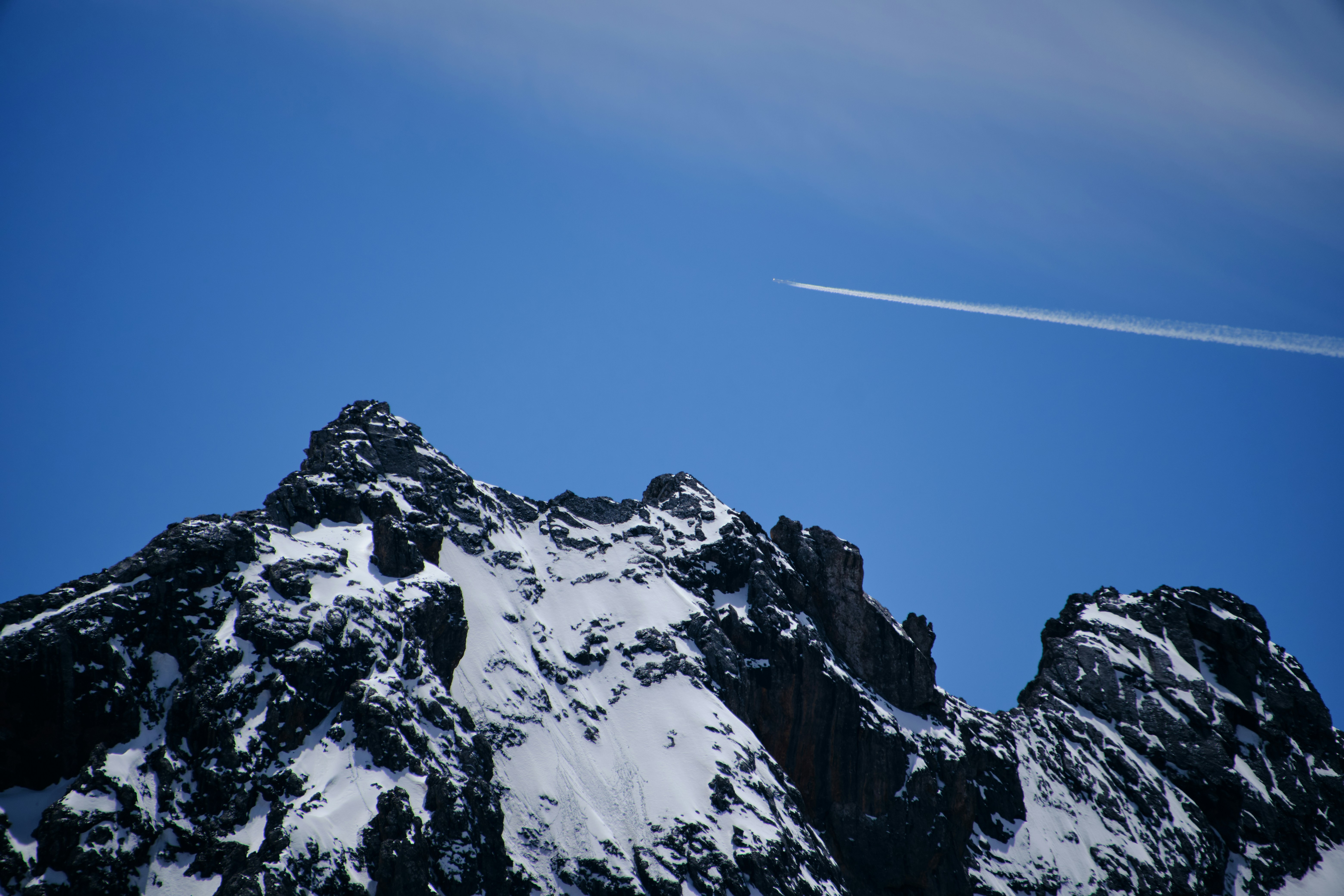 Snow-Crowned Ridge Under a Clear Cerulean Sky