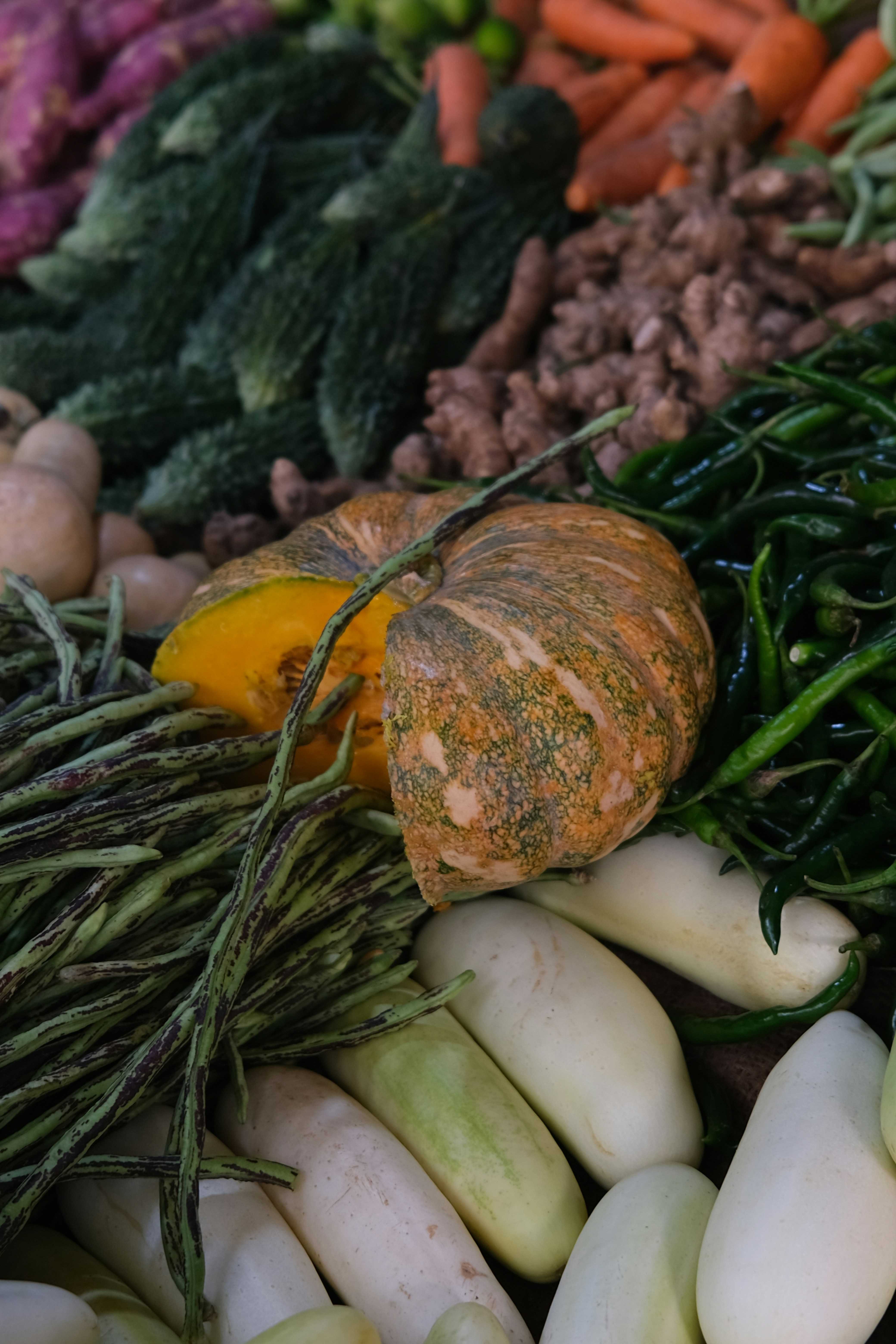 Pumpkin Crown Over a Market Bed of Roots and Greens
