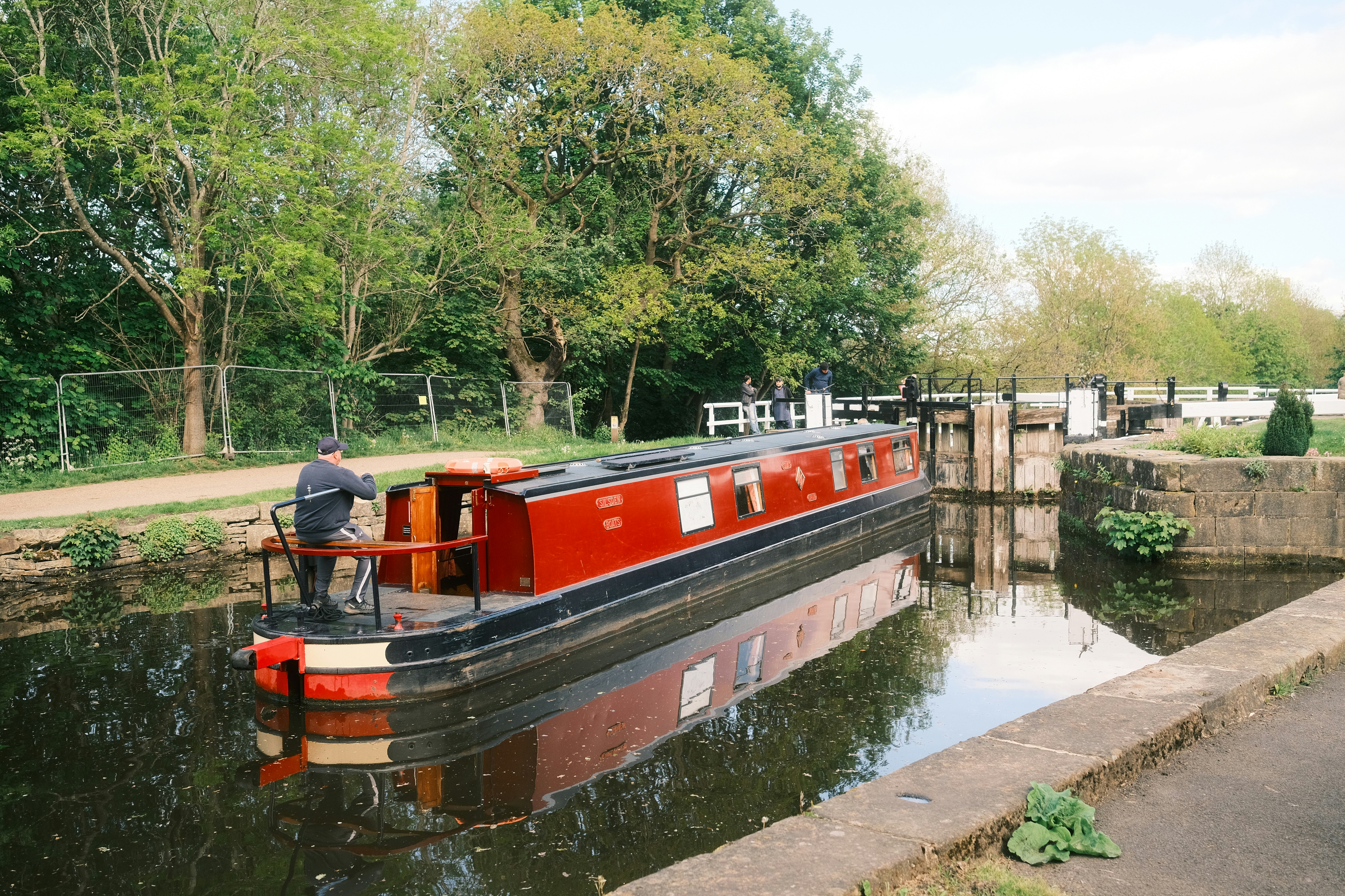 Red Narrowboat in Quiet Canal Lock