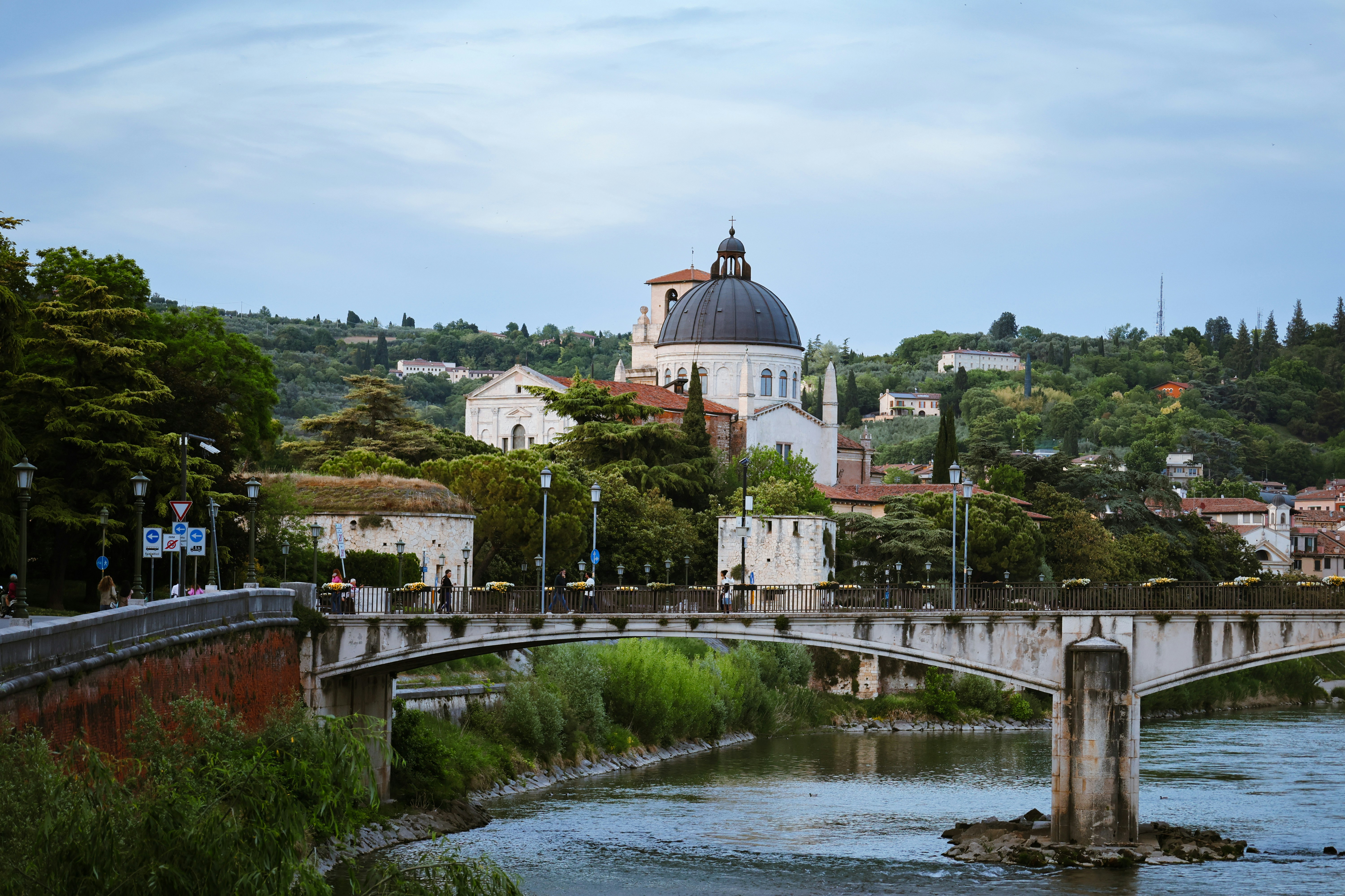 Dome and Bridge over the Quiet River in a Town Park