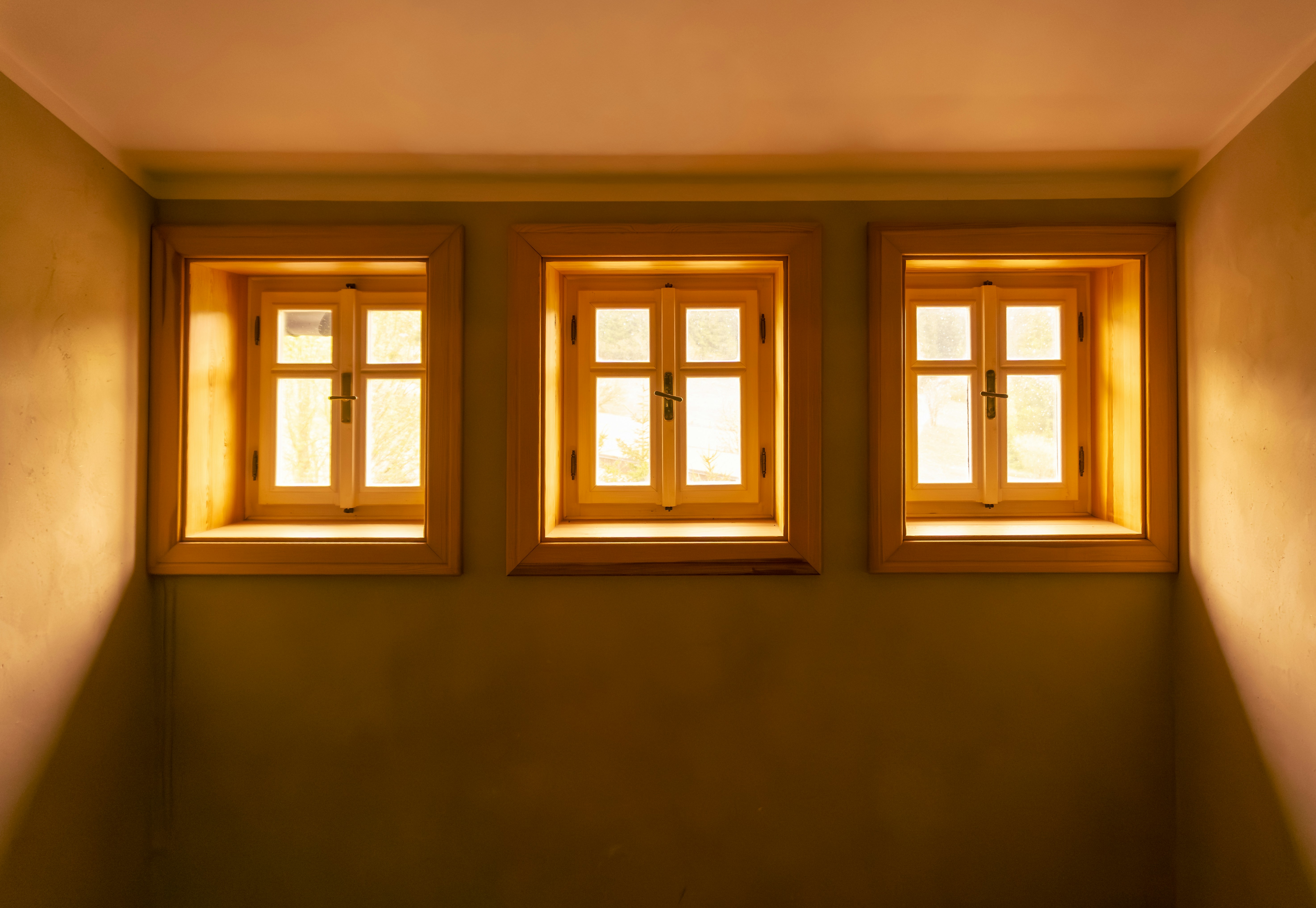 Three Golden Windows: Symmetry in a Quiet Stairwell