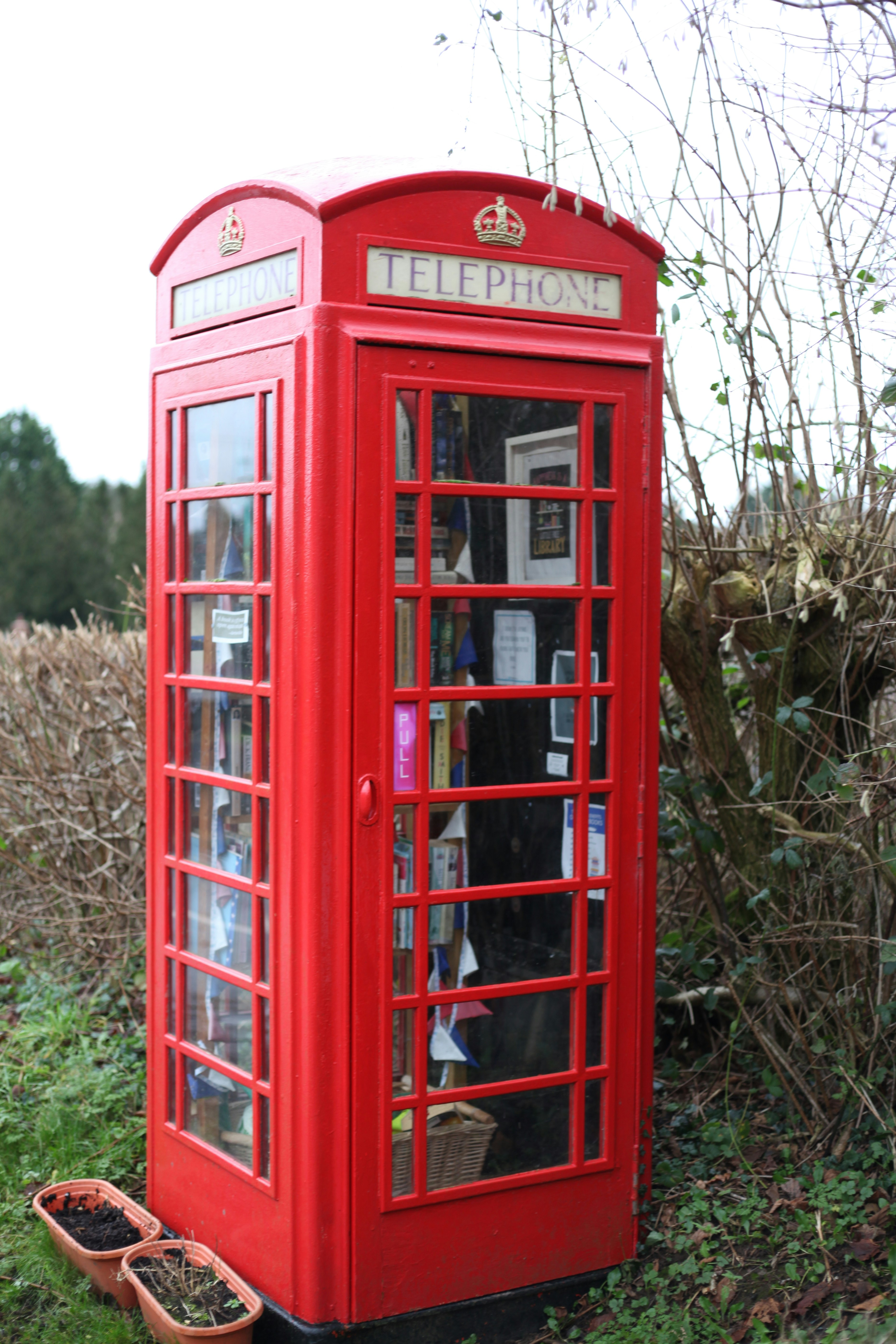 Crimson Cab: A Classic British Telephone Kiosk Standing Guard