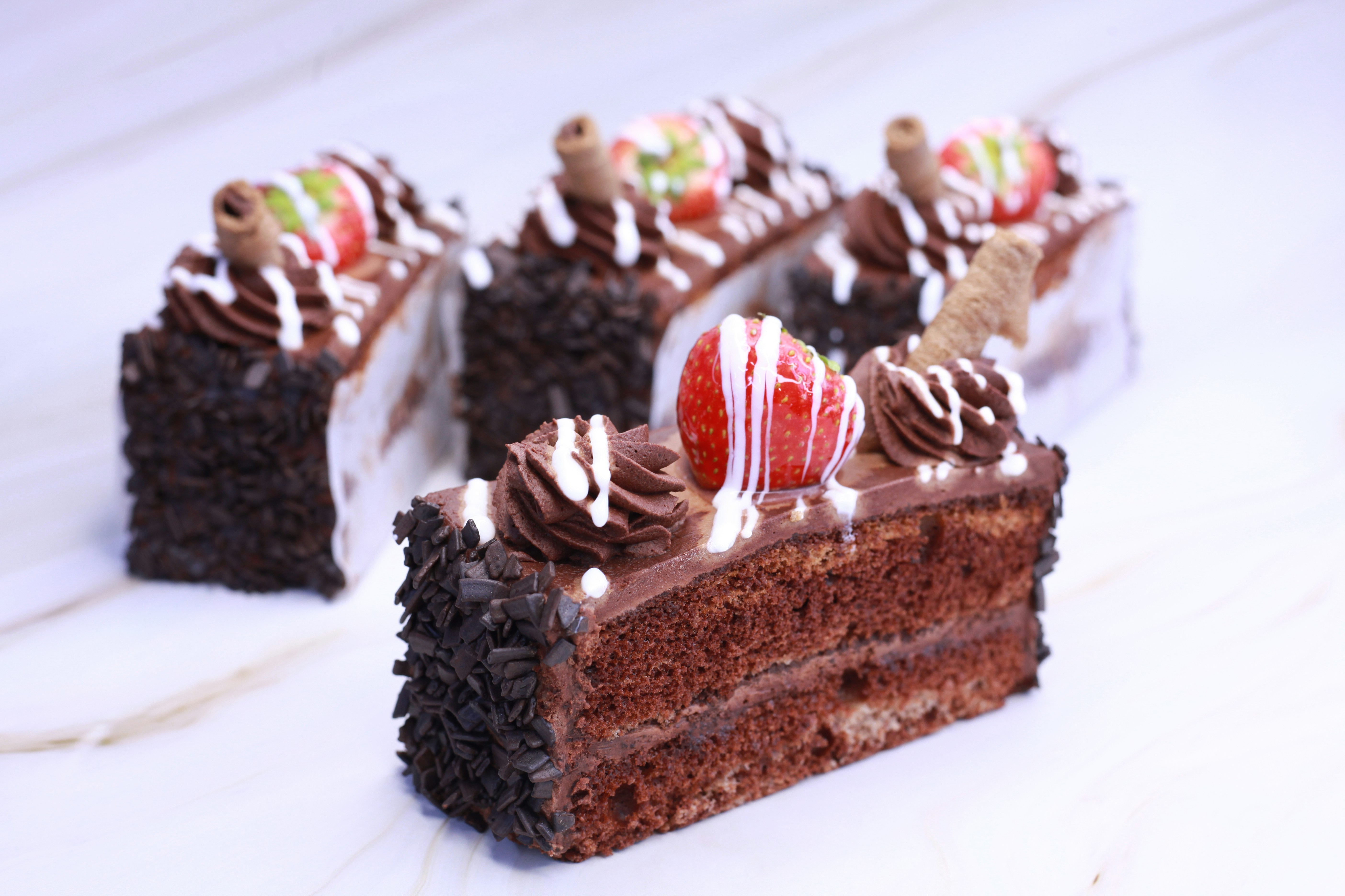 Decadent Chocolate Cakes with Peppermint Decor on Marble Surface