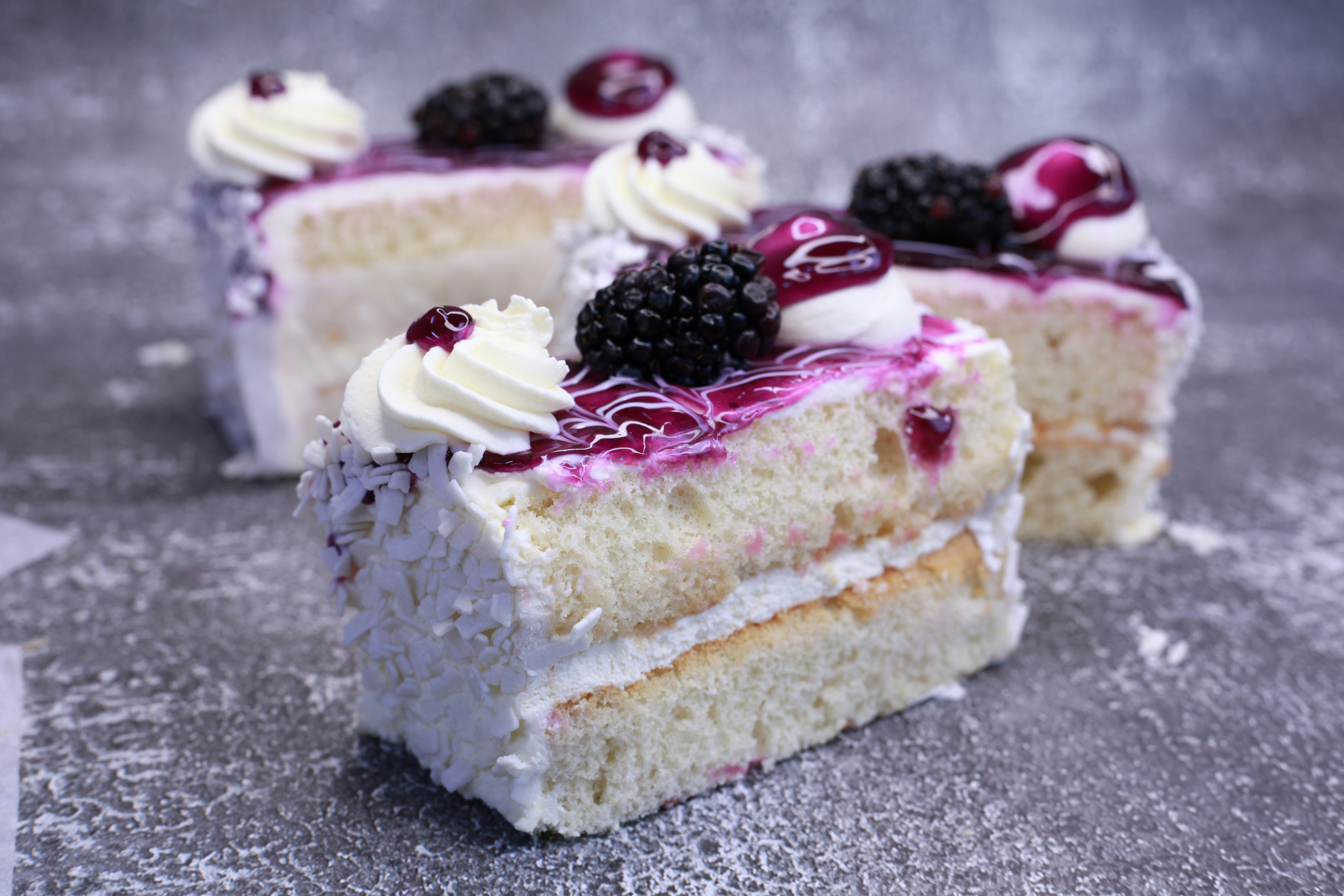Berry-Glazed Vanilla Layers: A Slice of Velvet Cake Elegance