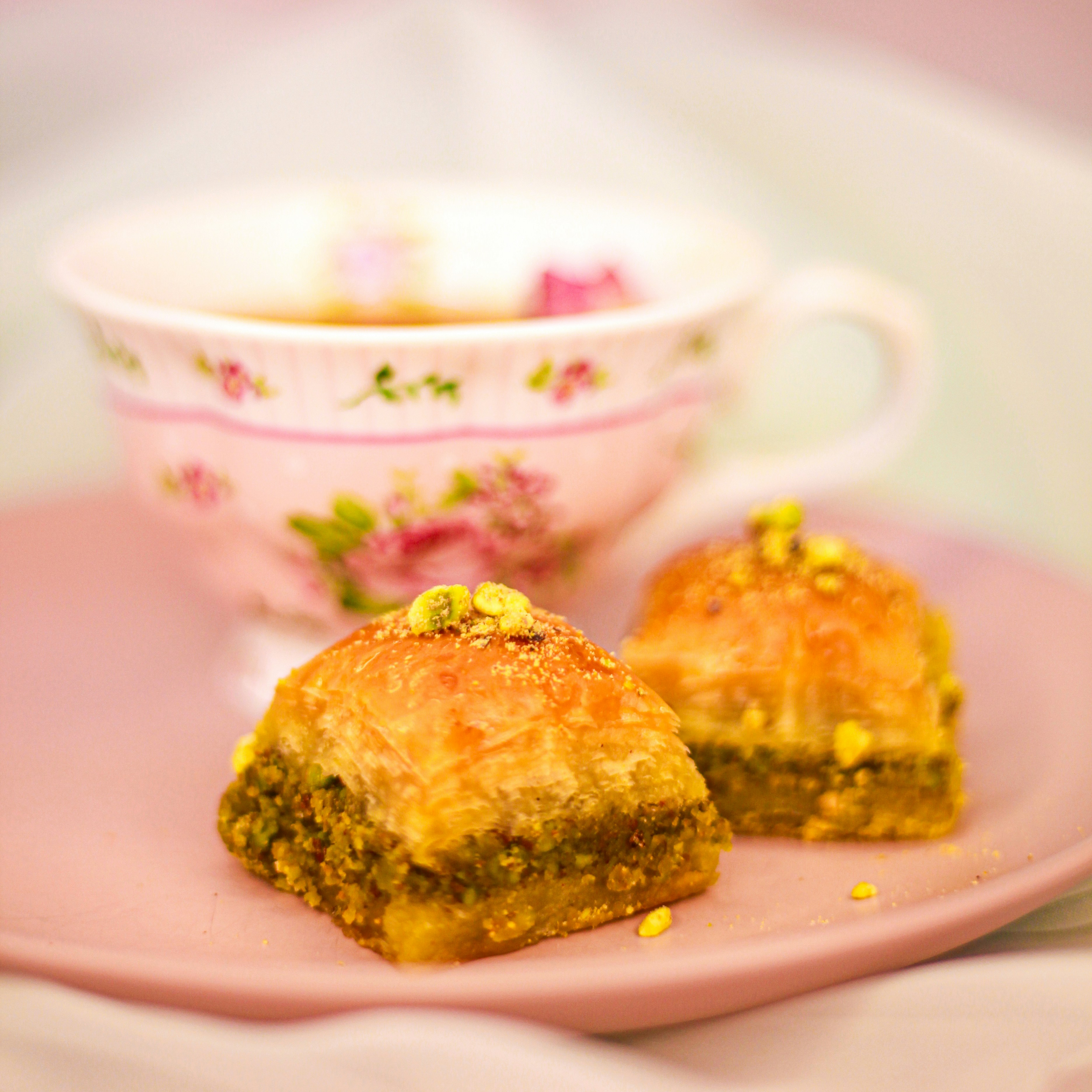 Pastel Teacup and Pistachio Baklava: A Gentle Dessert Moment