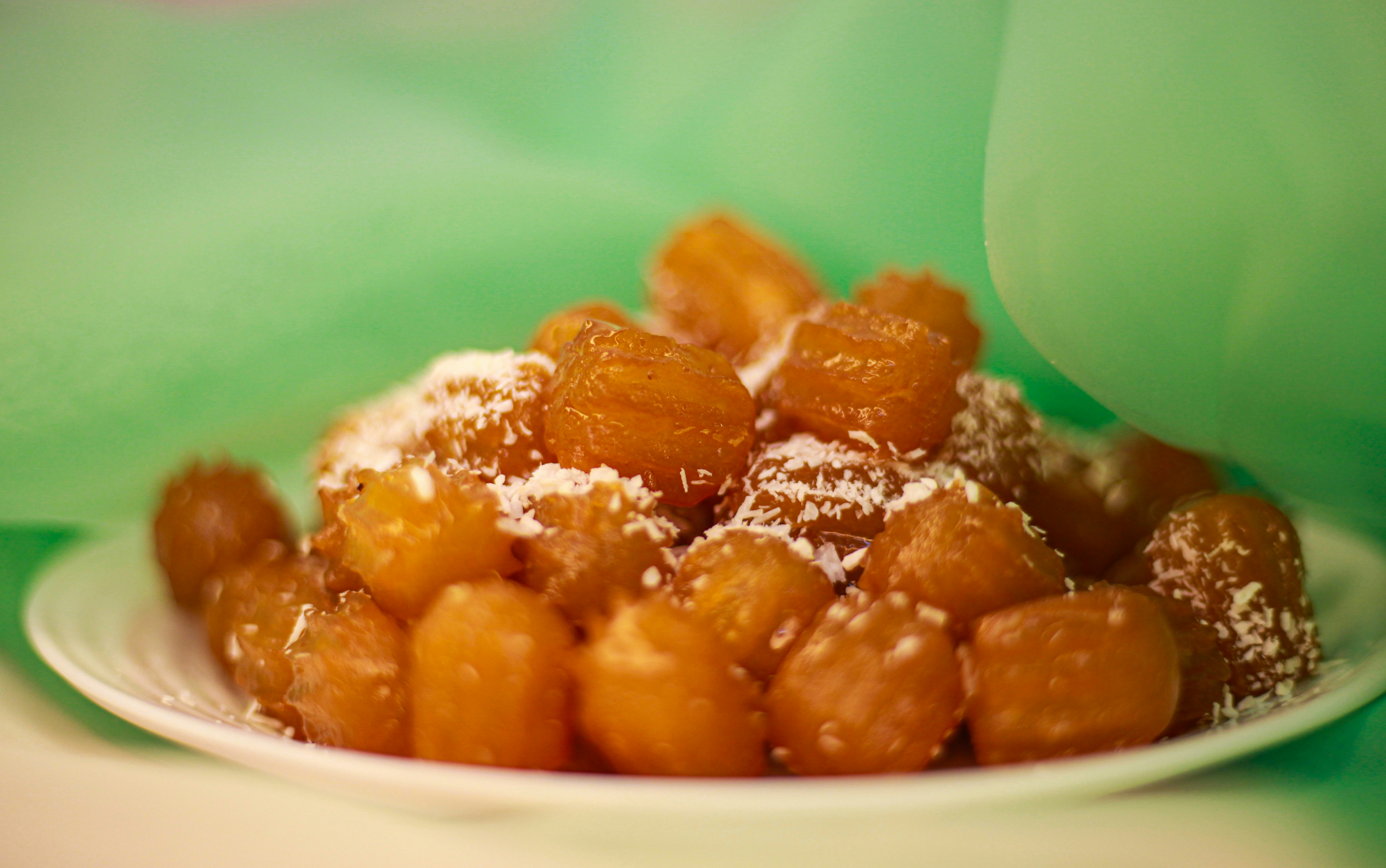 Dusted Delights: Glazed Churros Piled on a Plate