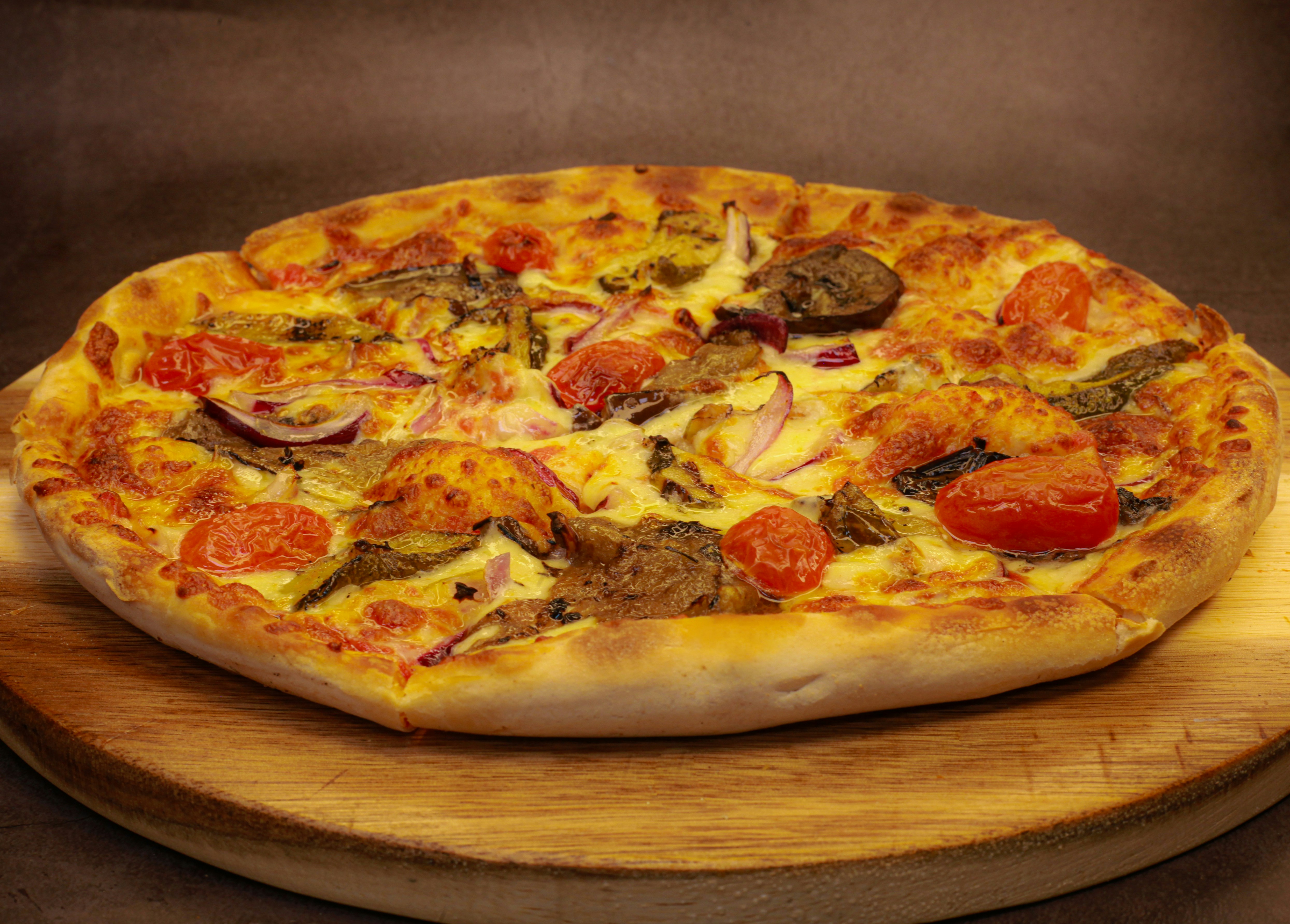 Wood-fired Pepperoni & Veggie Pizza on a Round Slate