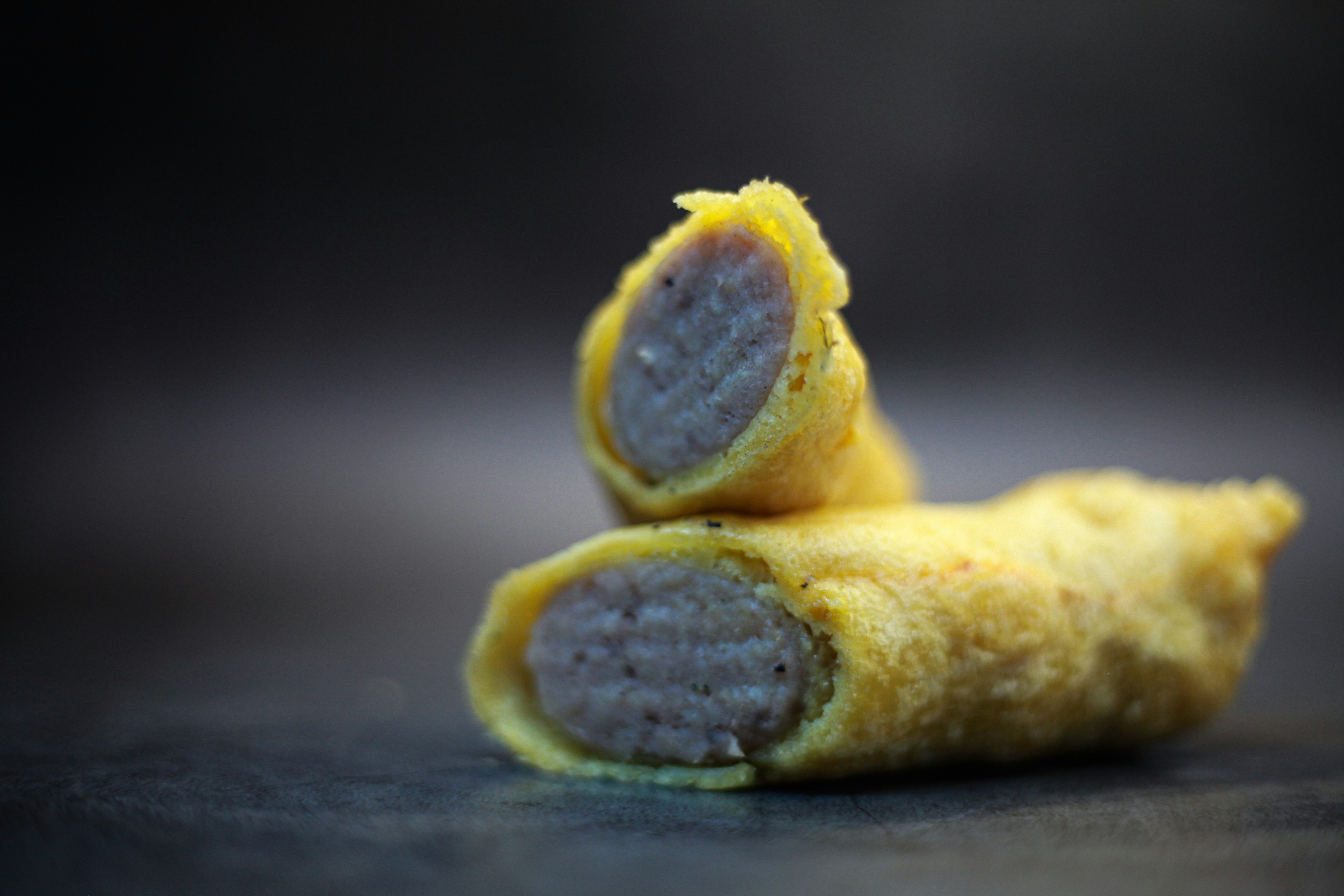 Crisped Byte-Sausages: A close-up of bite-sized tempura sausage snacks