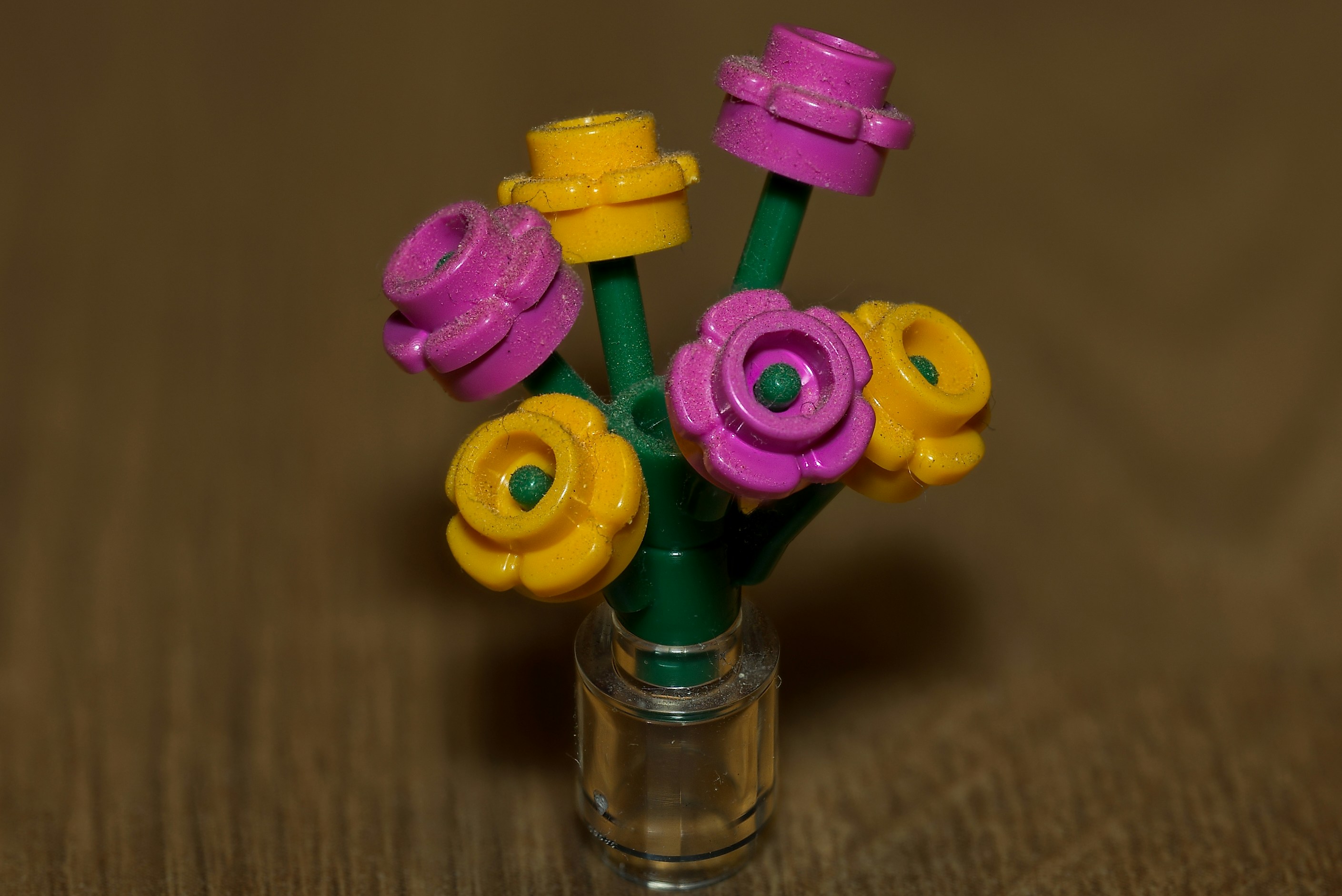 Tiny Toy Flowers in a Glass Vase: A Macro Study of Bright Plastics