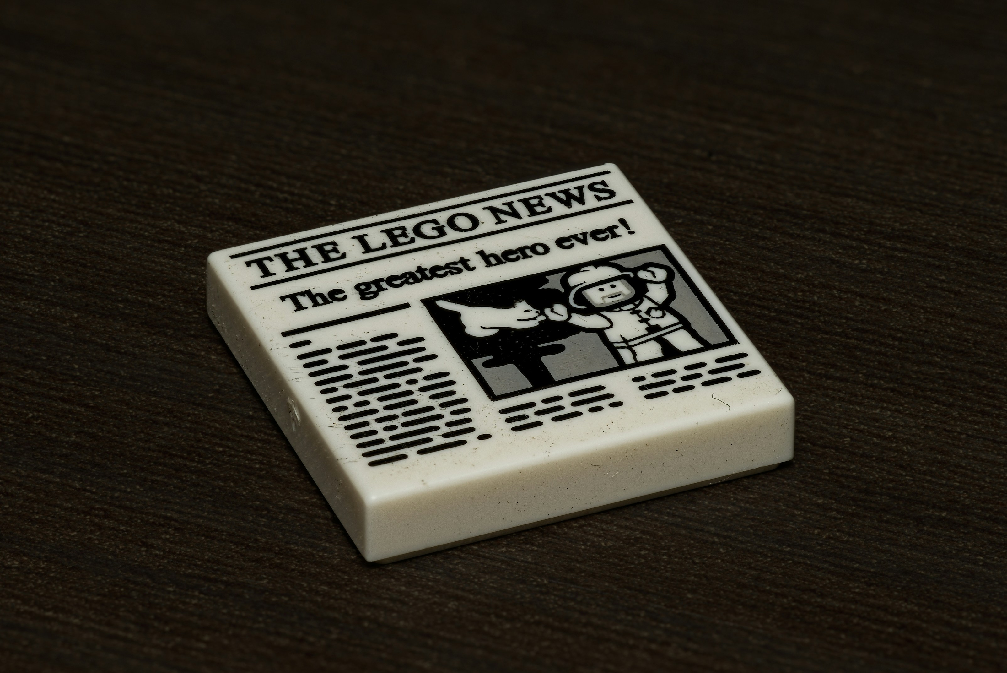 The Quiet Newsstand: A LEGO Press Parcel on Wood