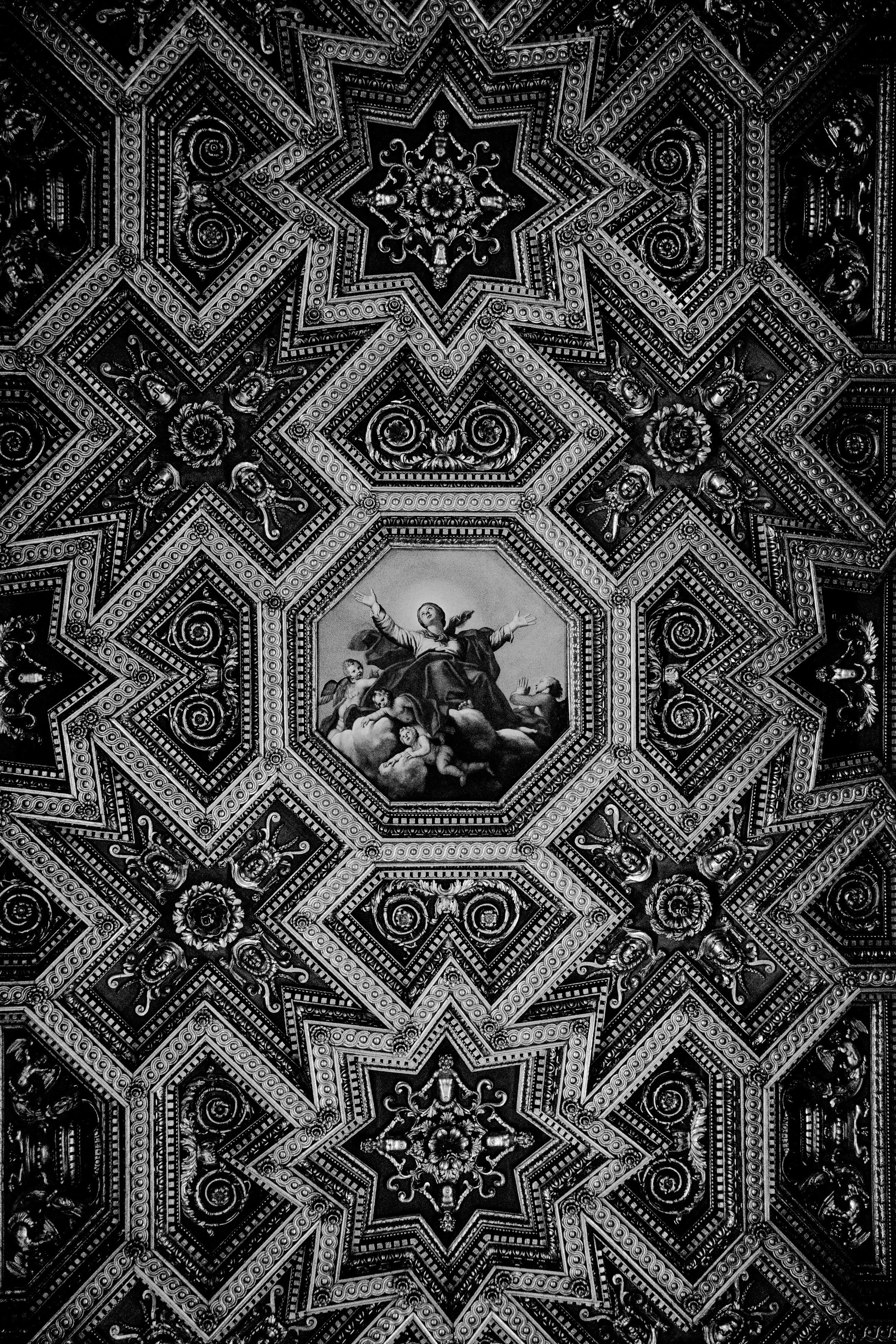 Ornate Vanishing Star: A Ceiling Mosaic Centered on a Classical Panel