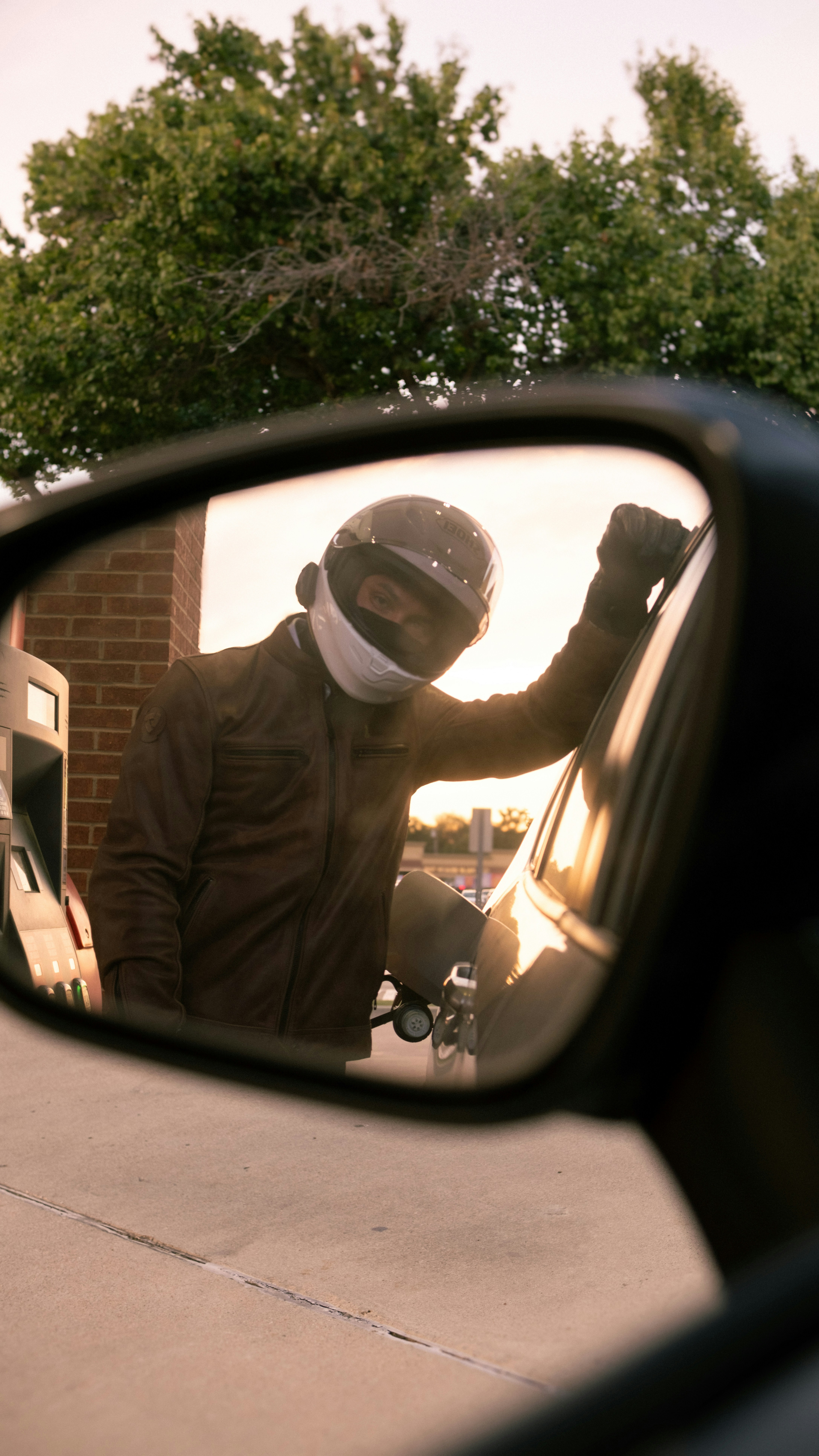 Facing the Frame: A Rider Reaches into the Glass