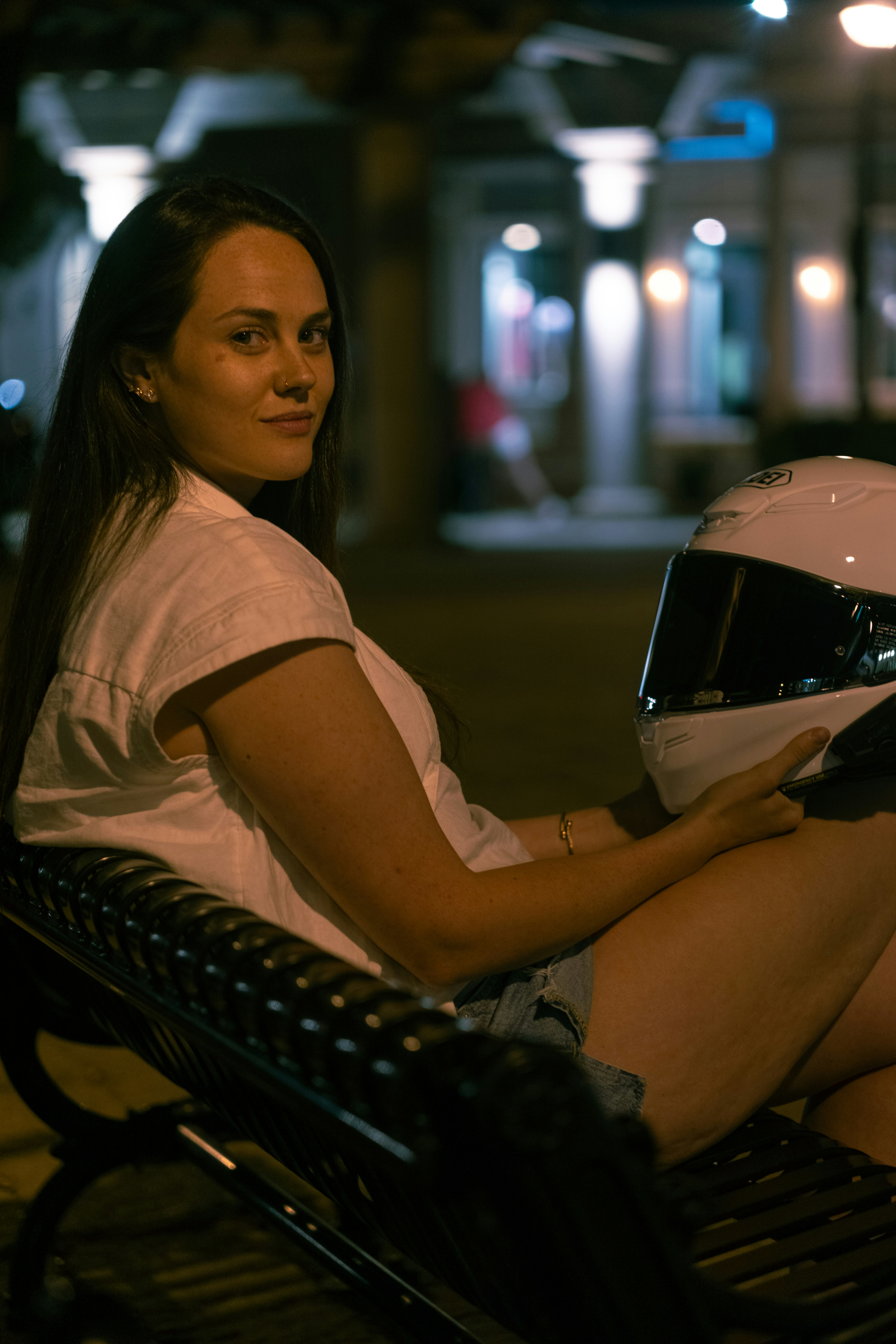 Nighttime Portrait on a Park Bench with Helmet in Hand