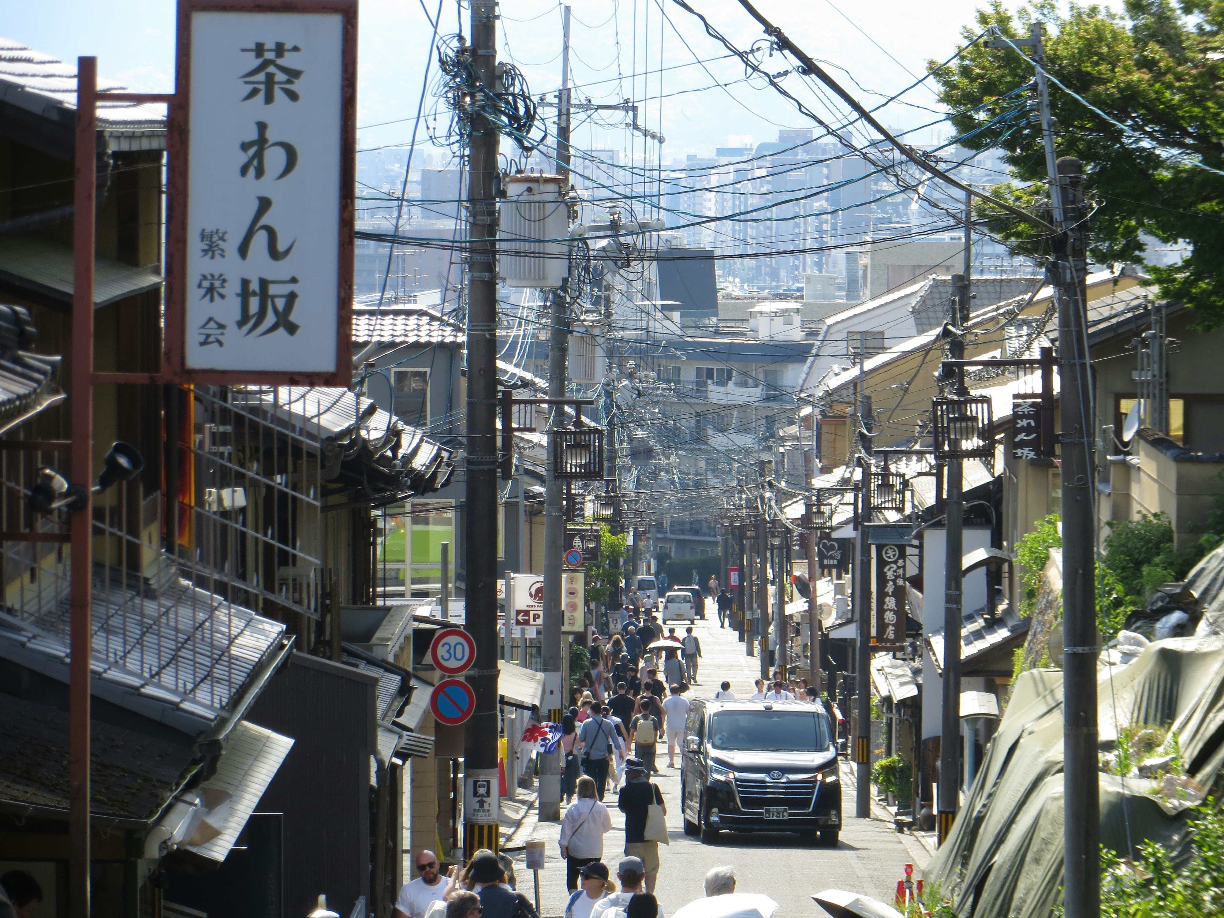 Sunlit Nakasugicho Street: A Quiet Corridor Busy with Passersby