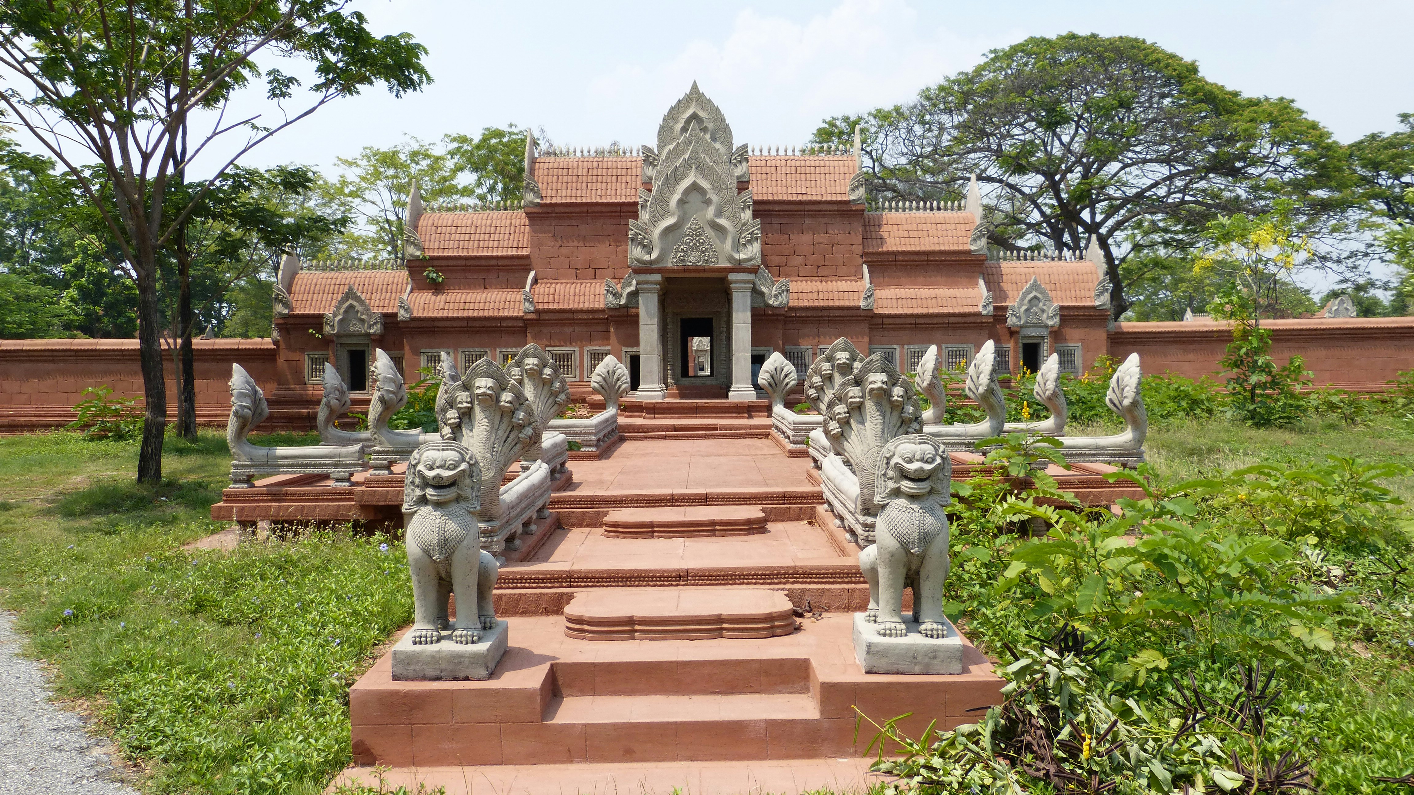 Temple Courtyard Gates: Stone Guardians Guard the Red Brick Staircase