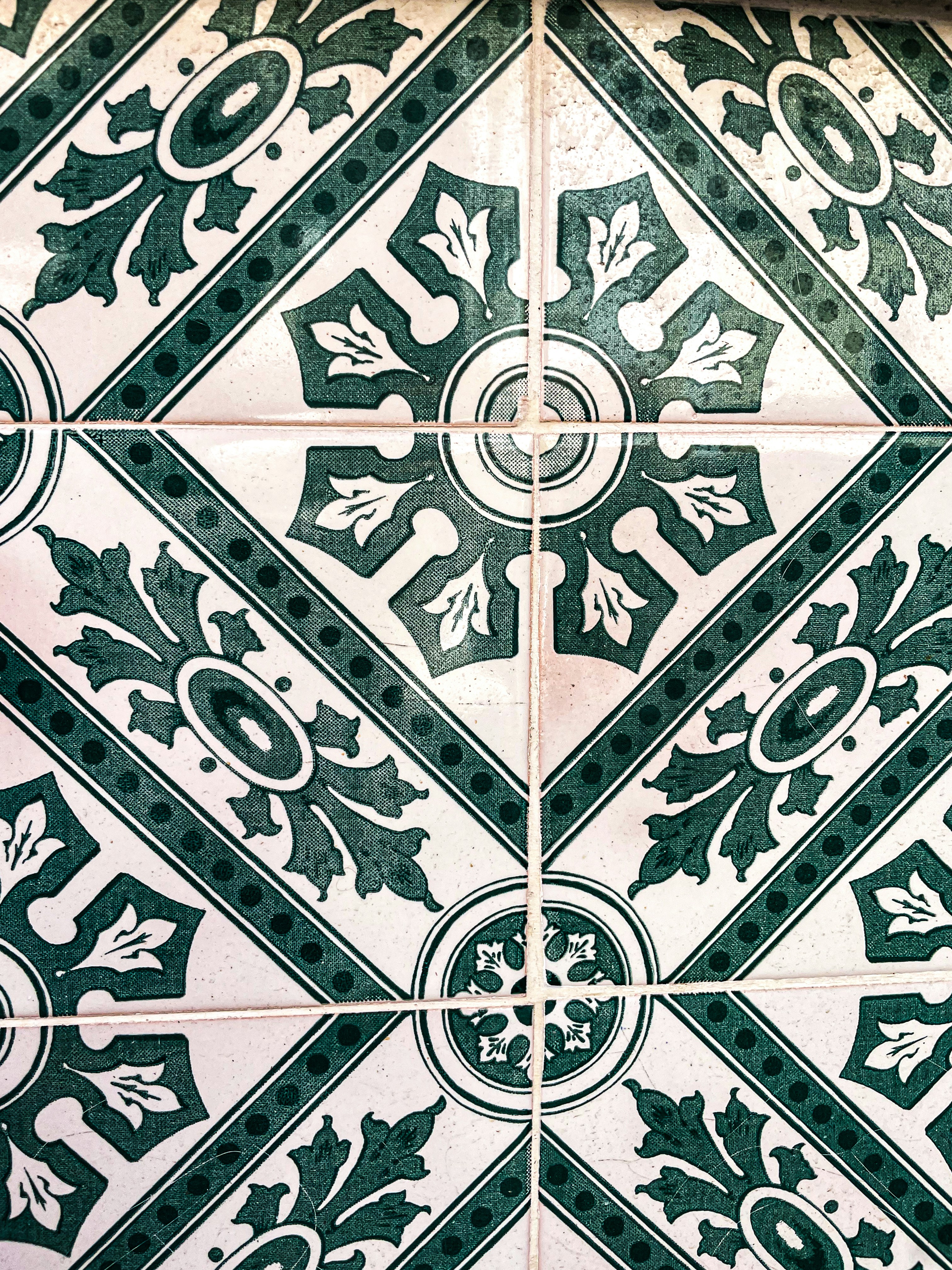 Geometric Tile Mosaic: Repeating Emerald Patterns in a Diamond Grid