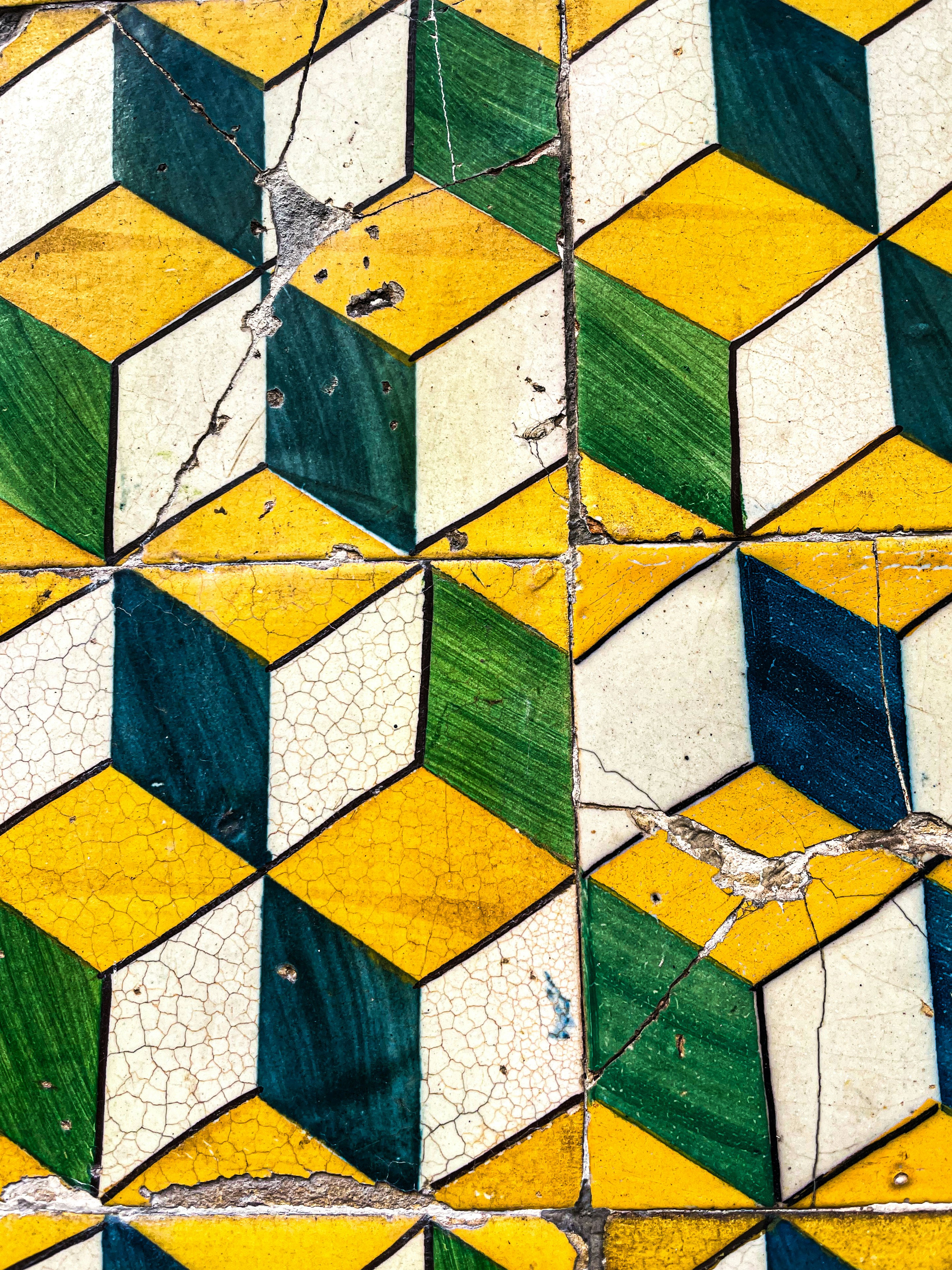 Cracked Color Tiling: A Geometric Mosaic of Yellow, Green, and Navy