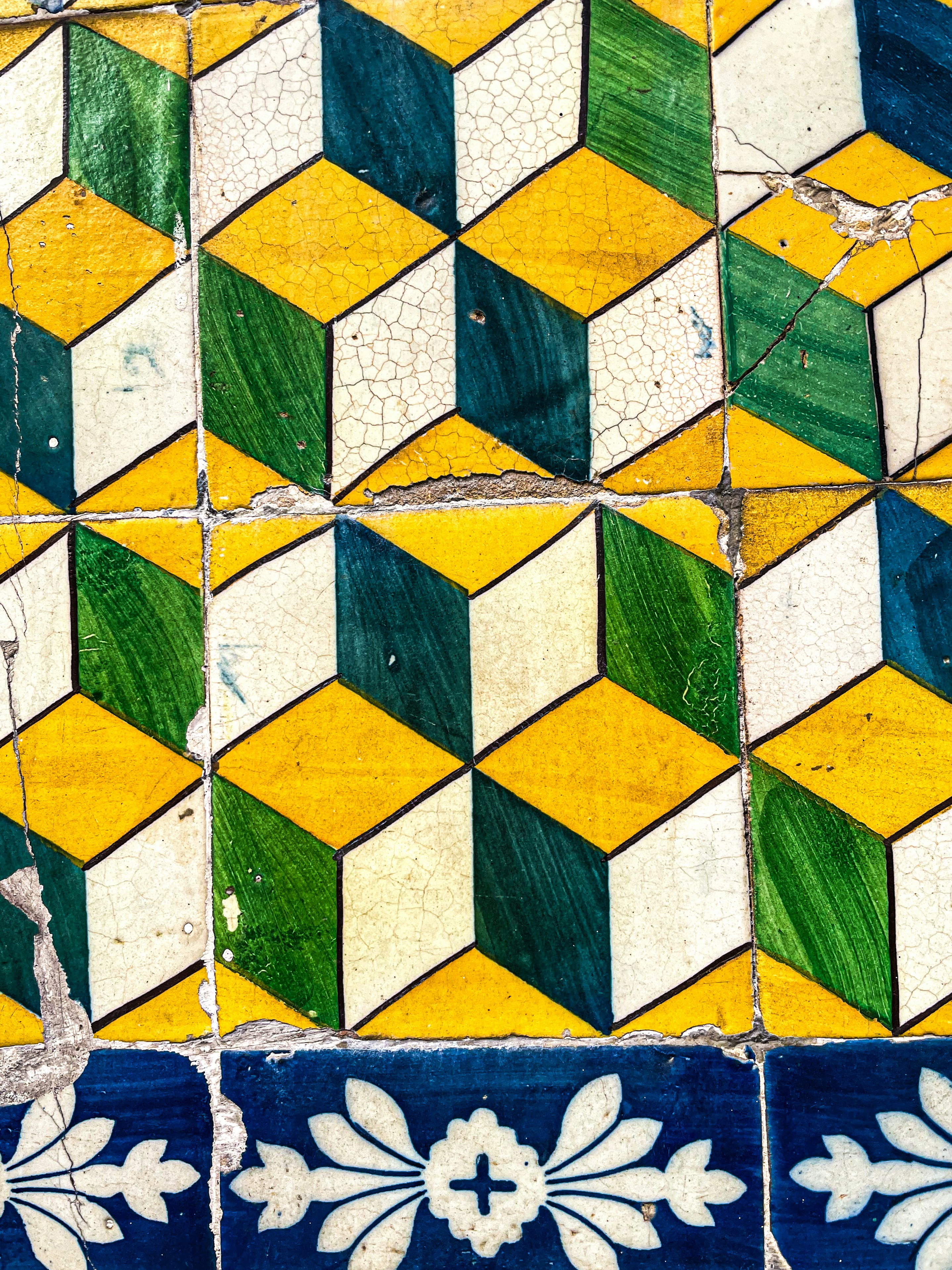 Tiled Geometry: A Tapestry of Yellow, Green, and Blue Diamond Cubes