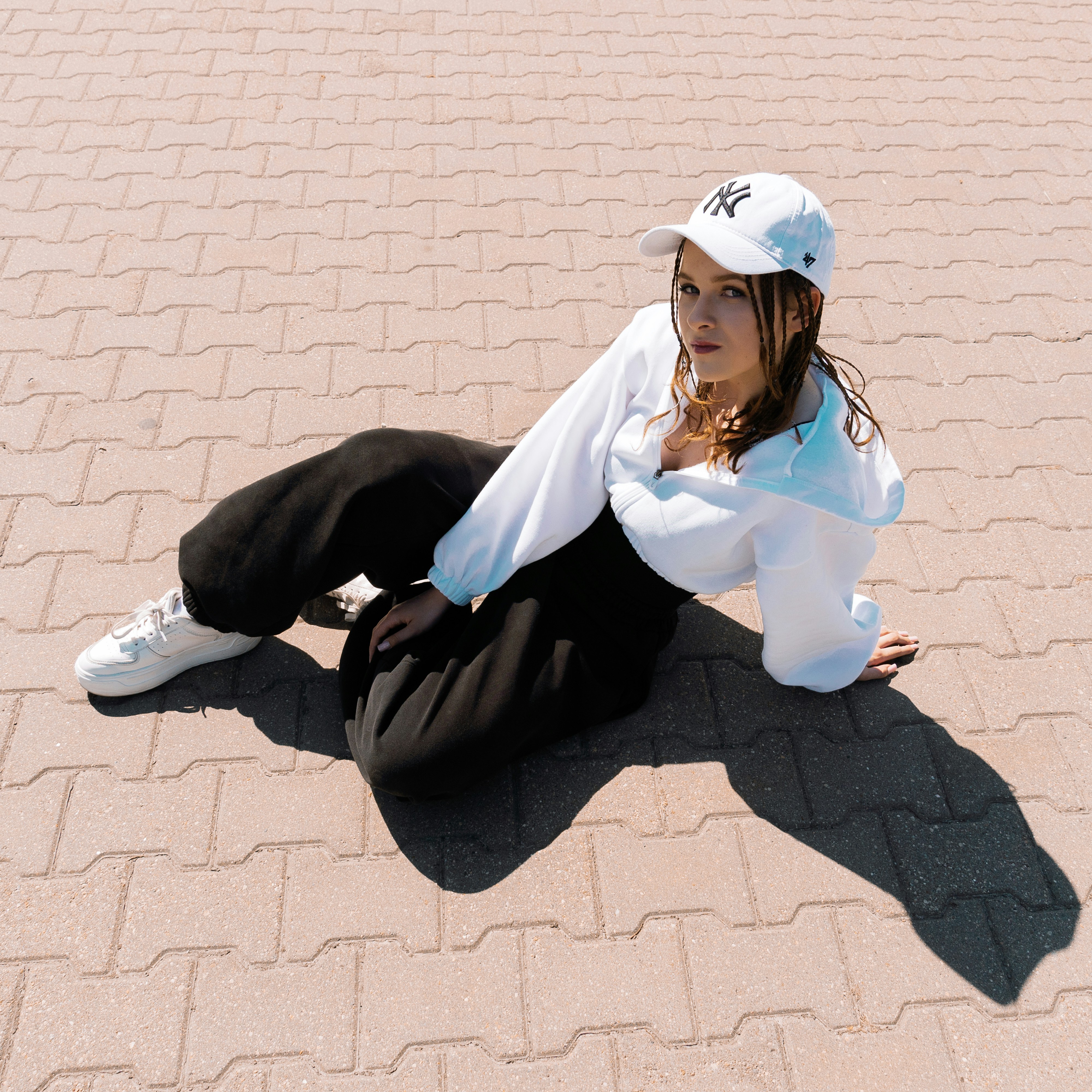 Grounded Pose: A Fashion-Forward Moment on Sunlit Pavers