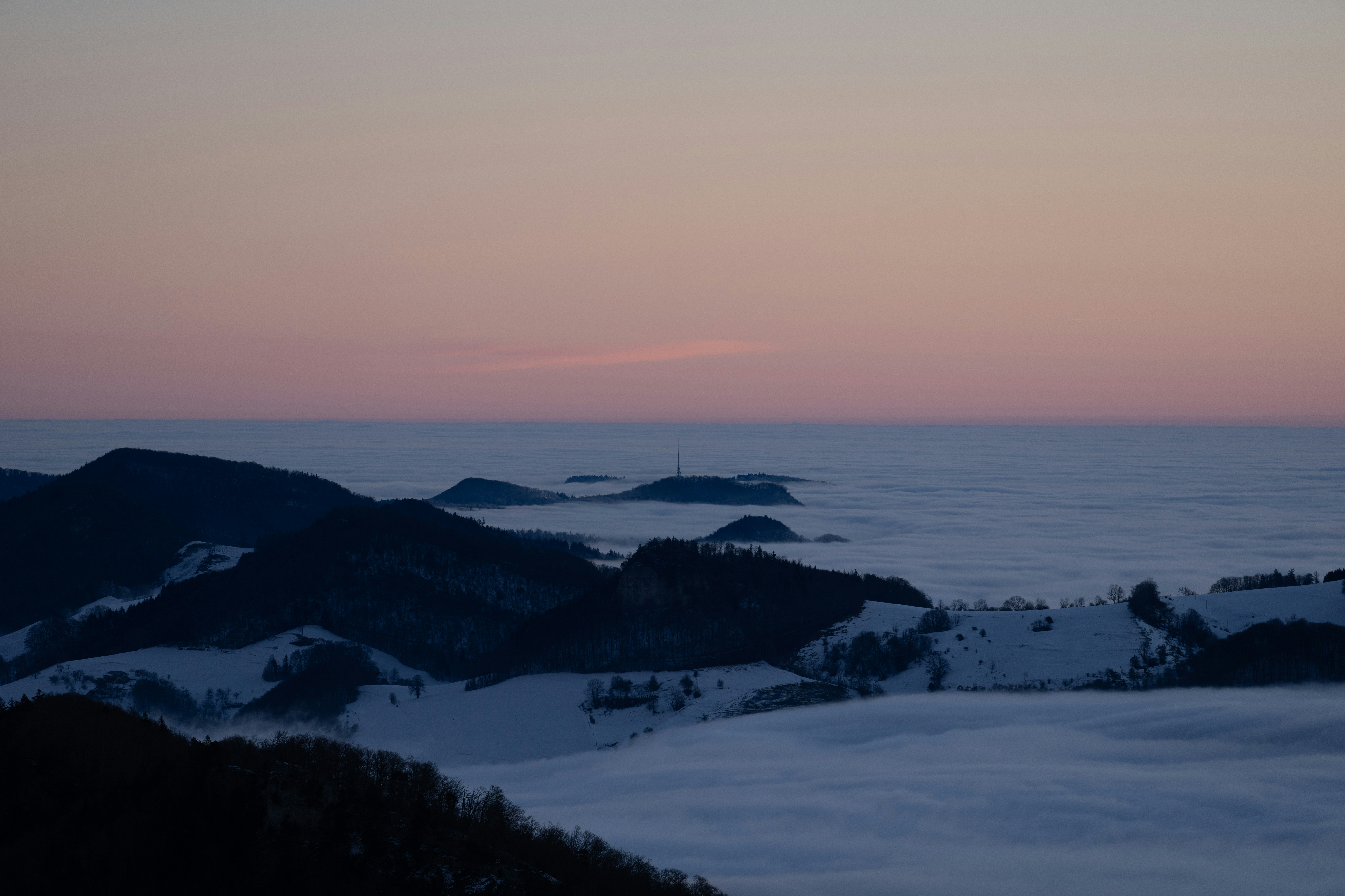 Sunset Over Misty Coastal Hills