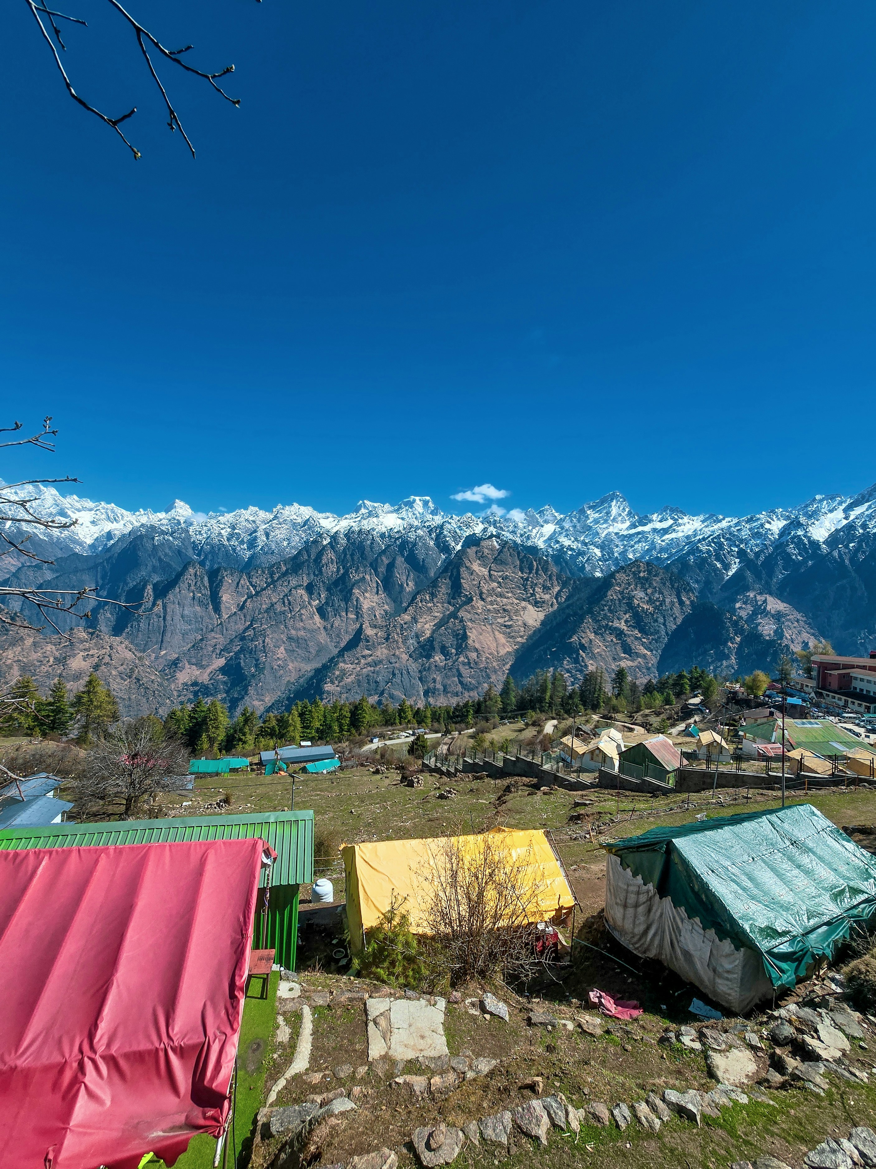 Colorful Camps against a Snow-Capped Backbone