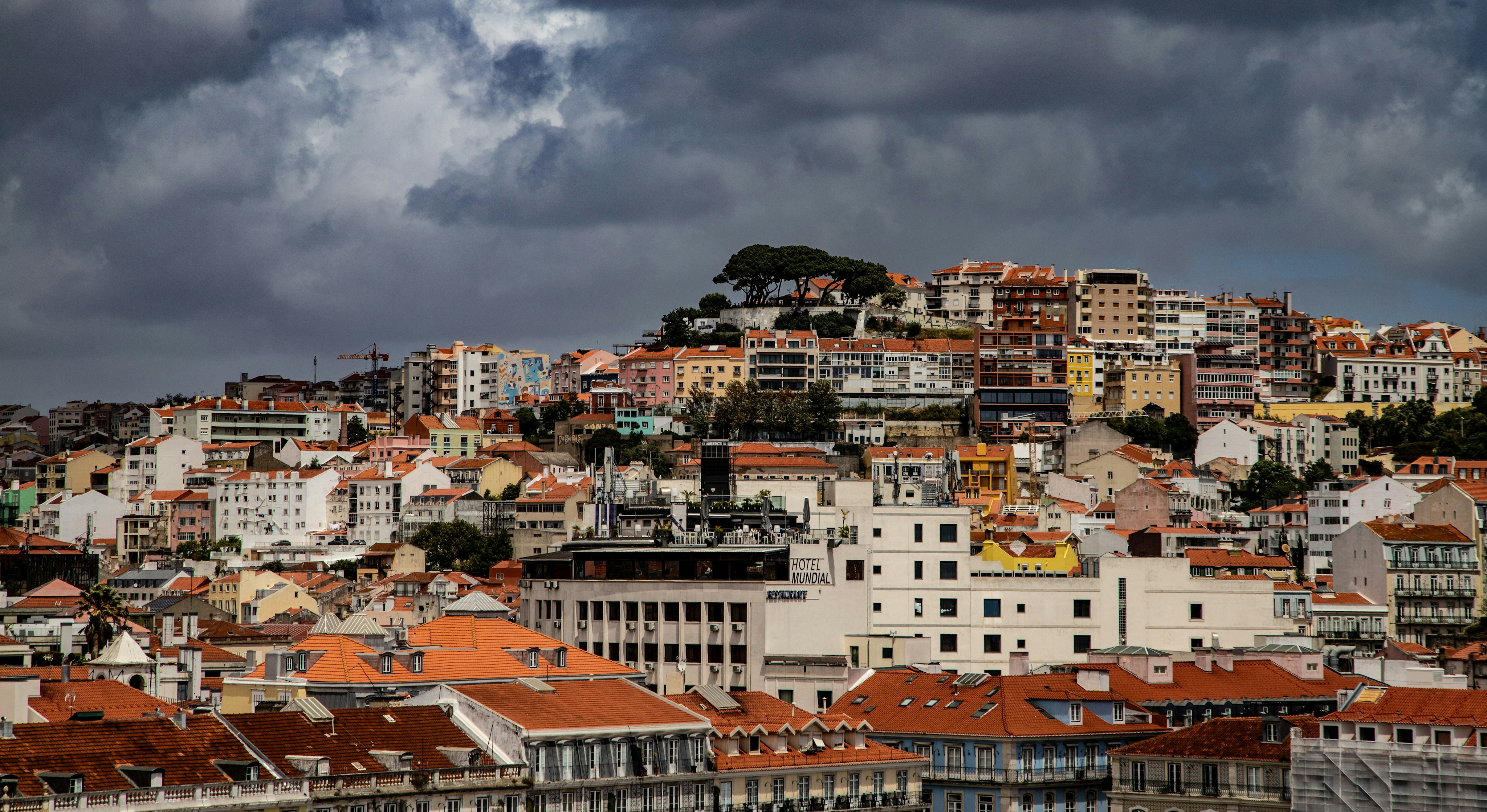 Terraced skyline: a sunlit hillside of terracotta roofs crowning a dense urban mosaic