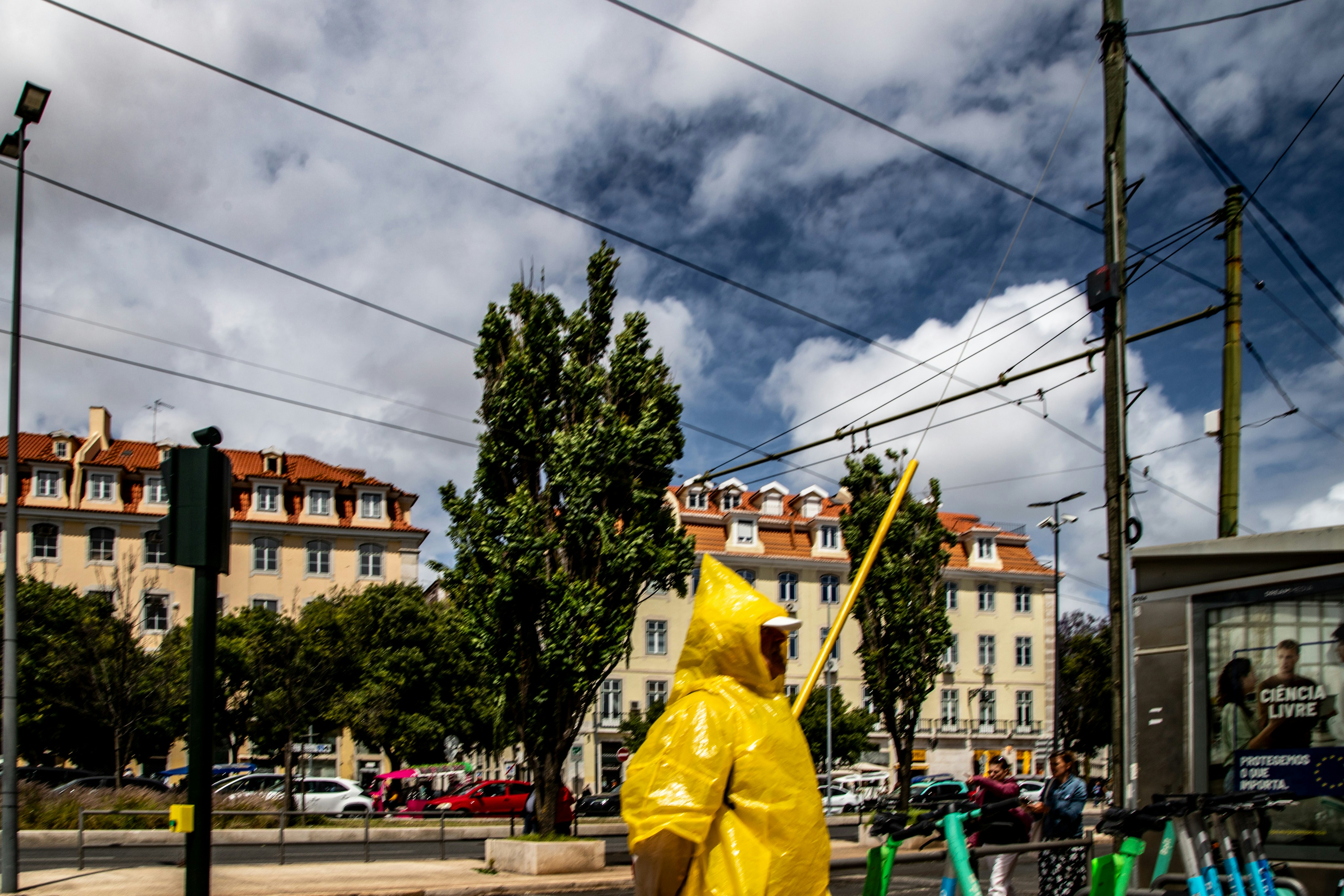 Yellow HazMat Glove: City Street Under Rainy Sky